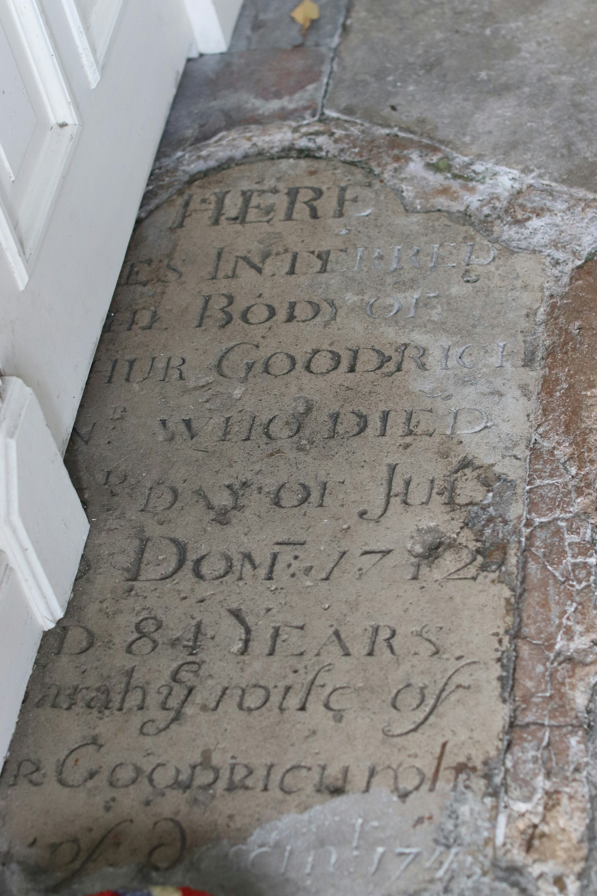 Threshold Script: Faded Inscriptions Beneath a Doorway