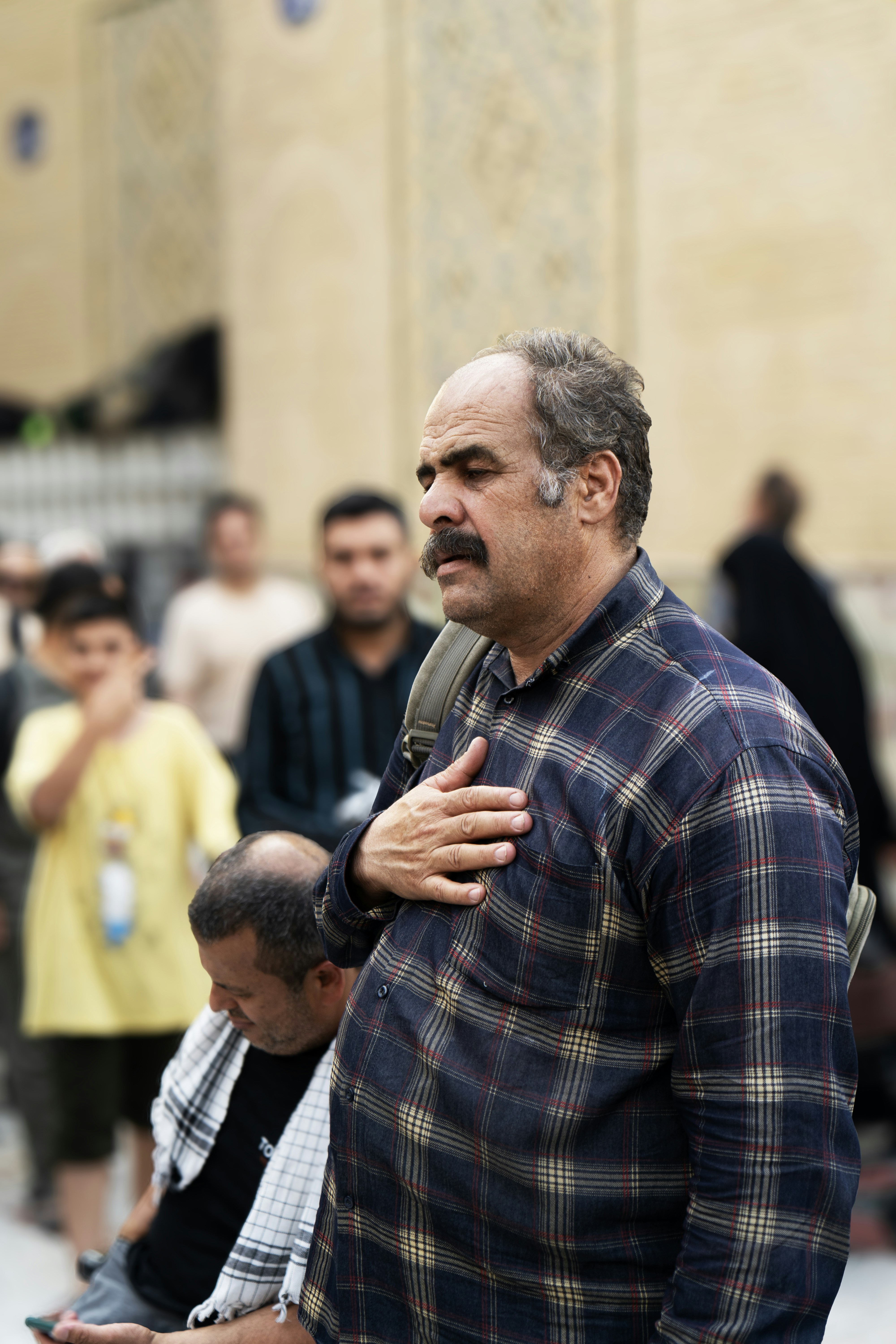 The Hand on the Chest: A Quiet Moment in a Public Square