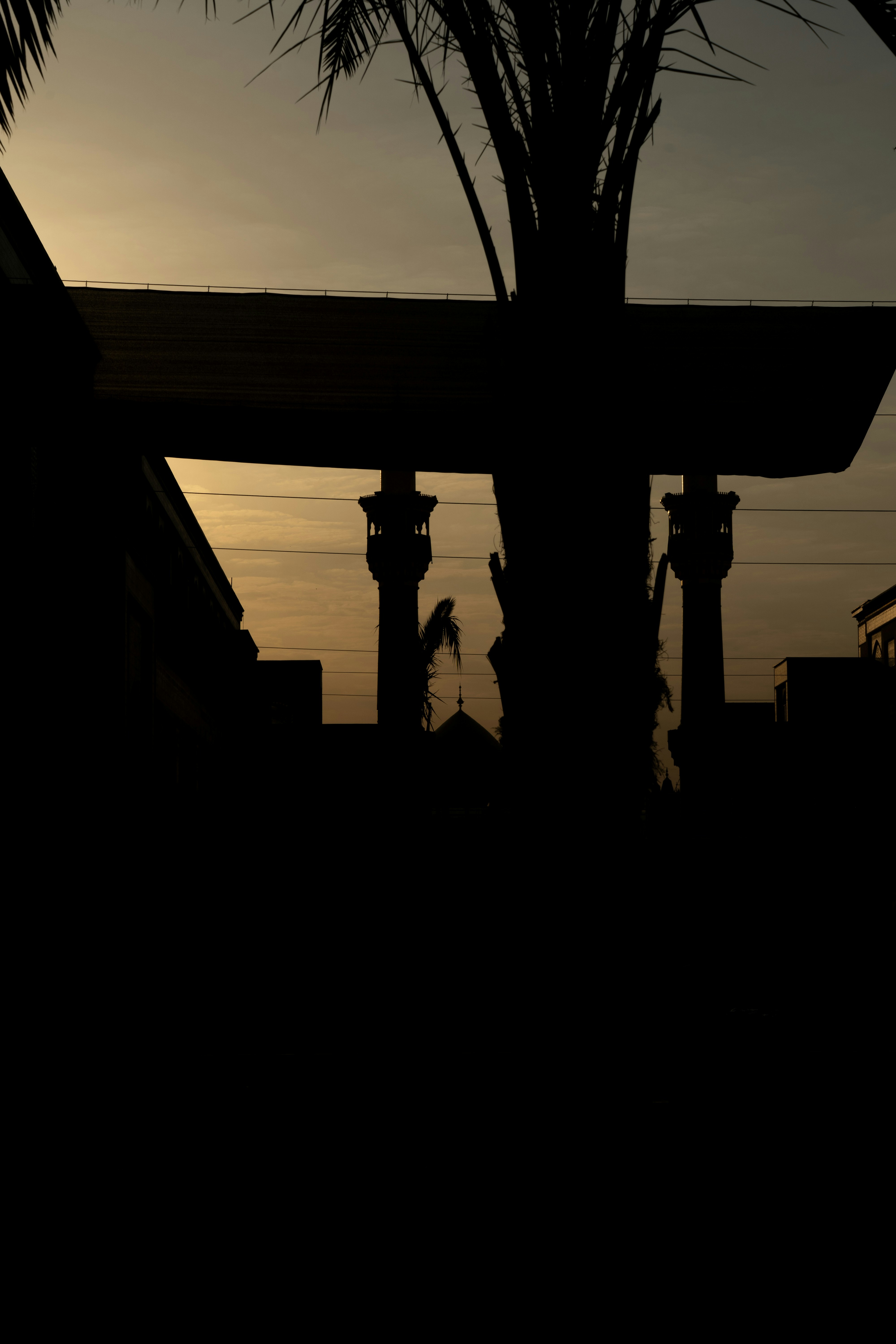 Sunset Silhouette Under an A-frame Plaza