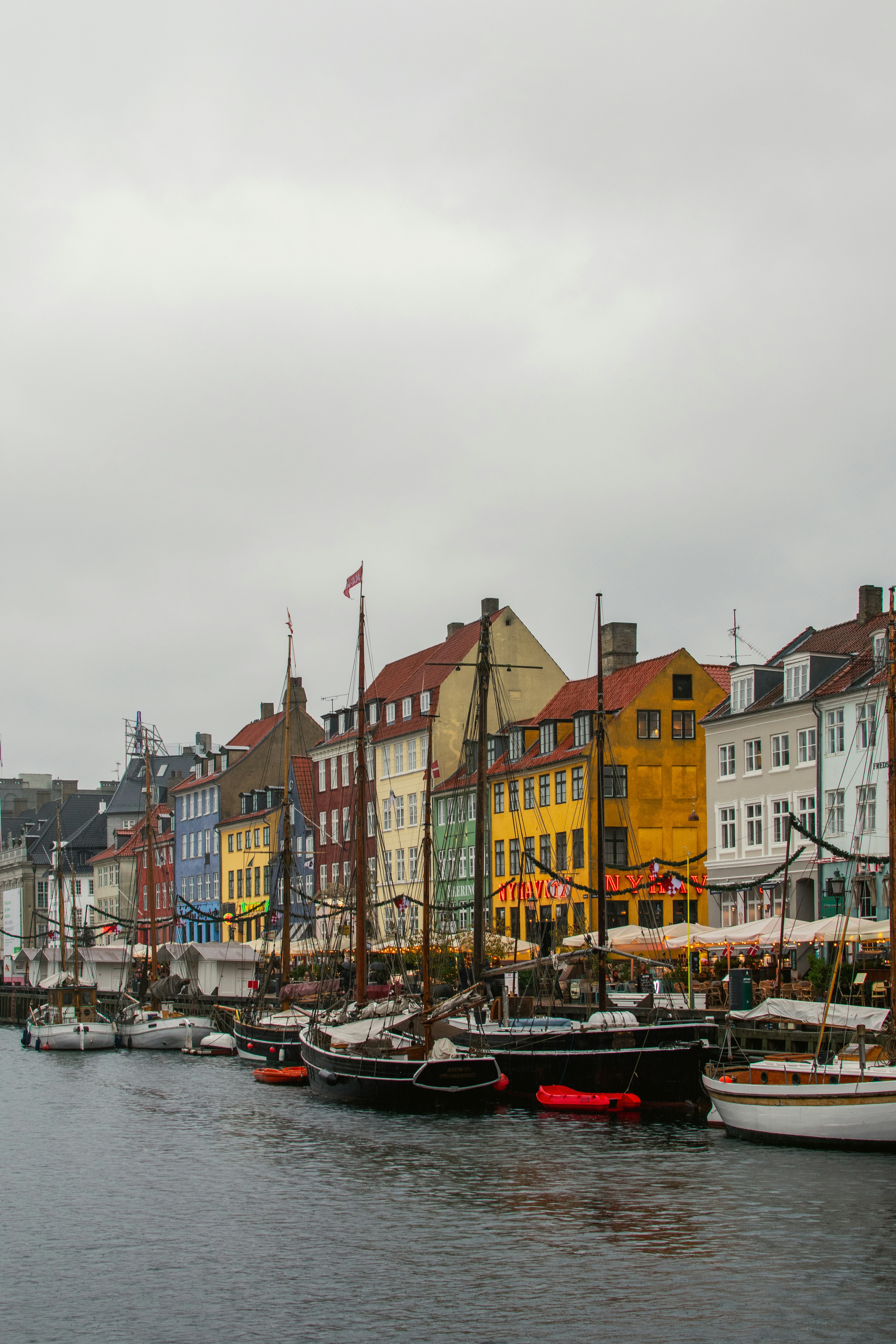 Nyhavn's Rainbow Row: Sailboats Moored Beneath Colorful Townhouses