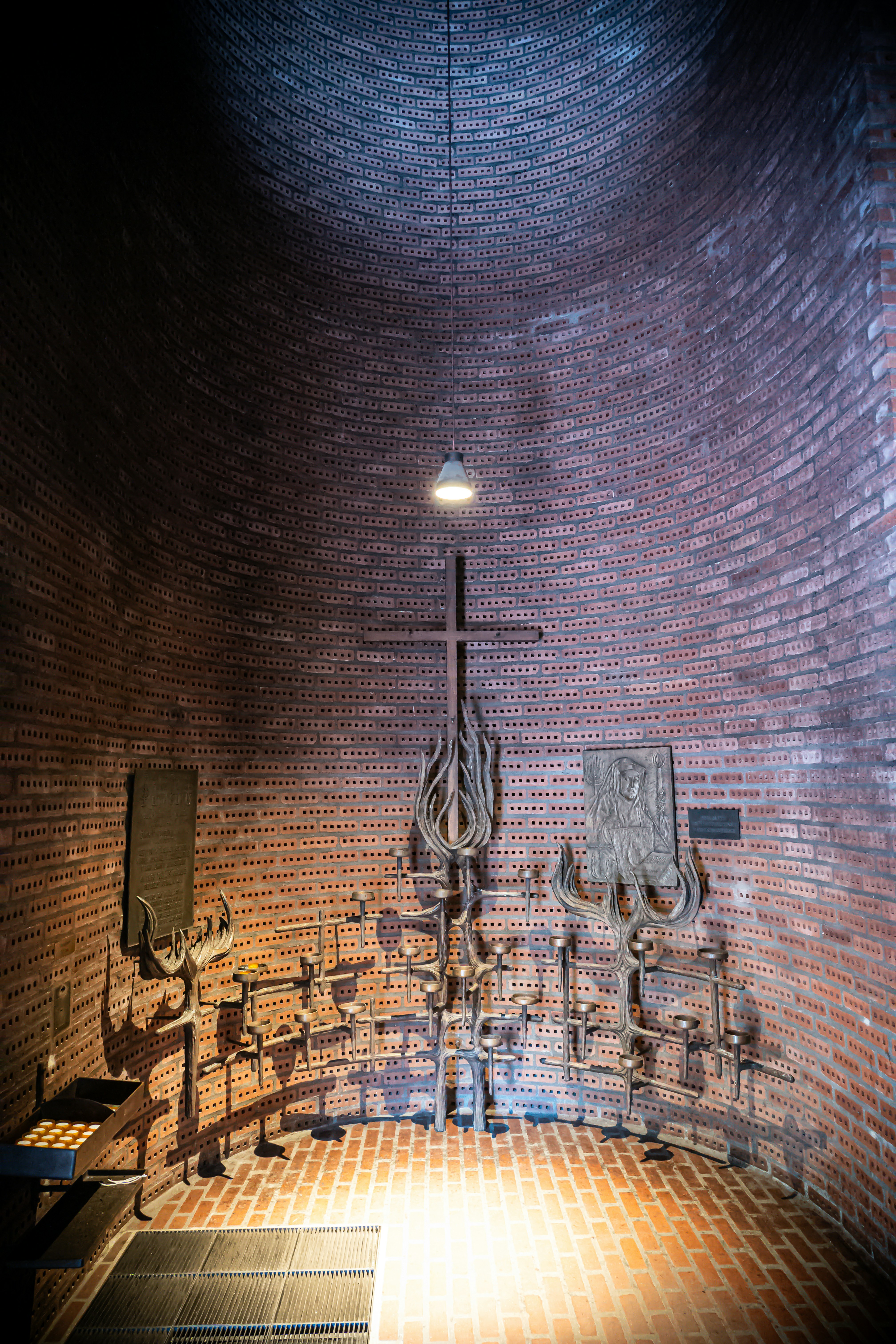 Lantern-lit Cross at the Core of a Brick-Cylinder Chapel