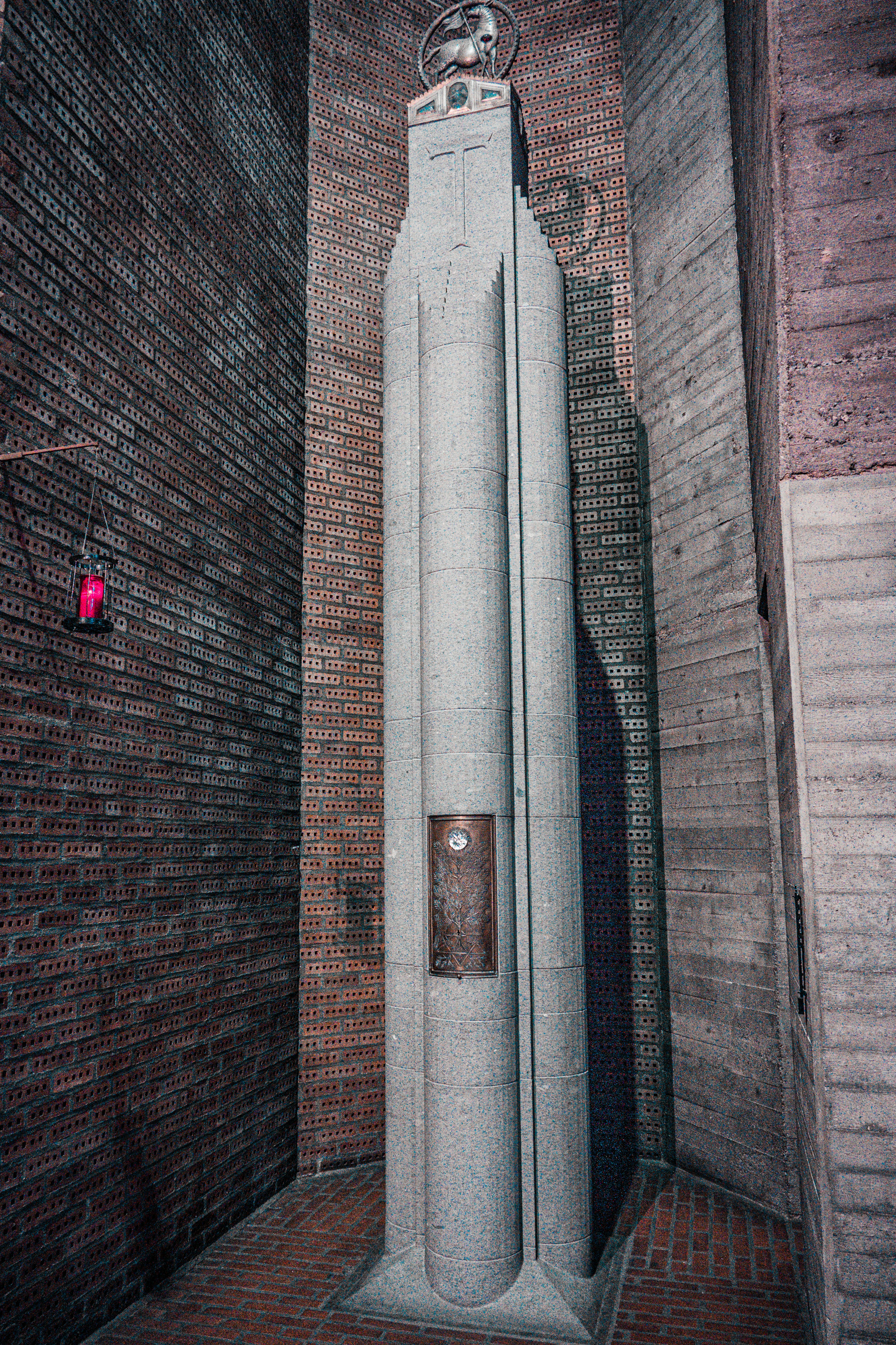 The Quiet Spire: A Marble Pillar Surmounting Brick Walls