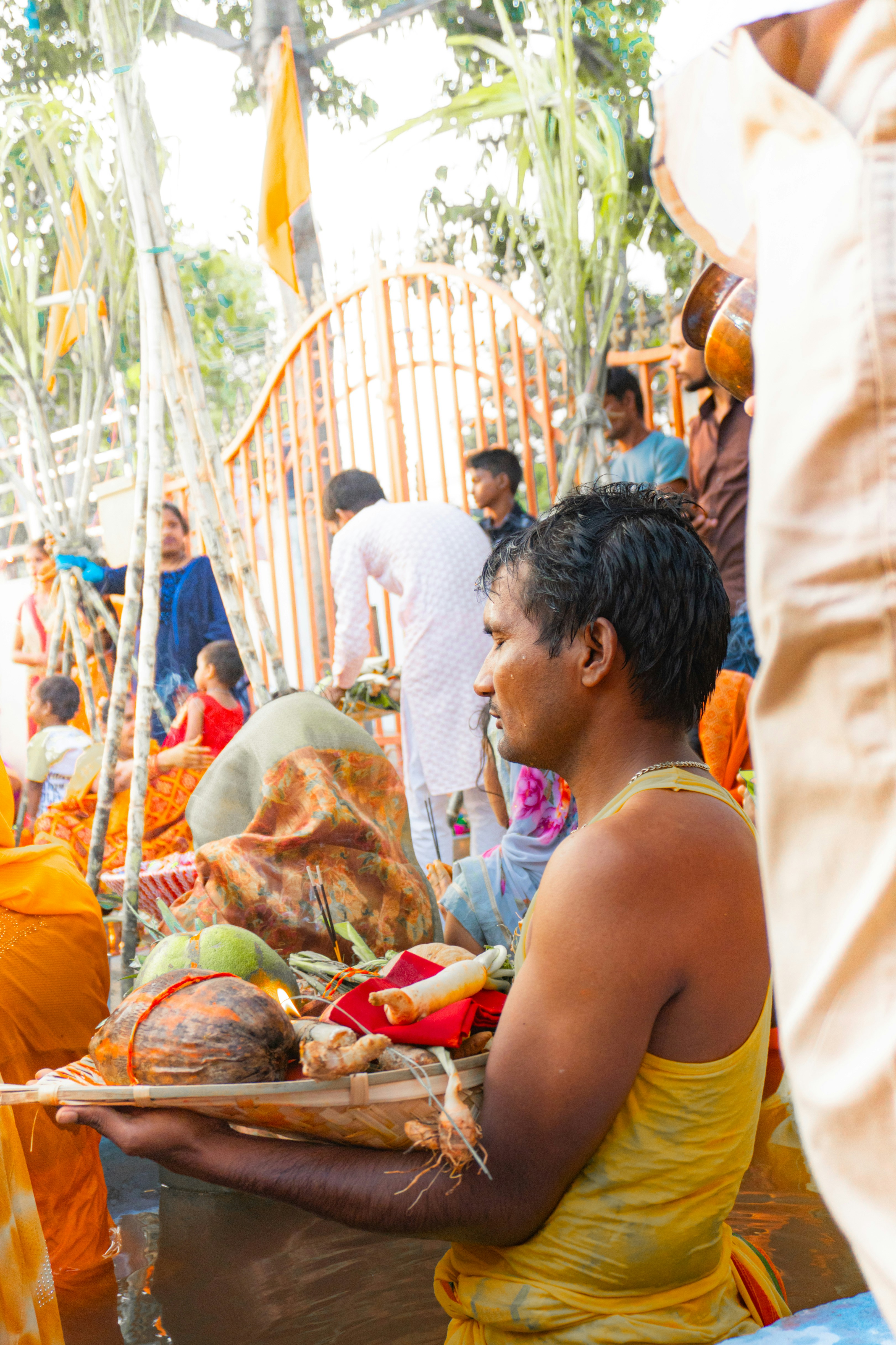 Golden Tray of Offerings in a Sunlit Temple Procession