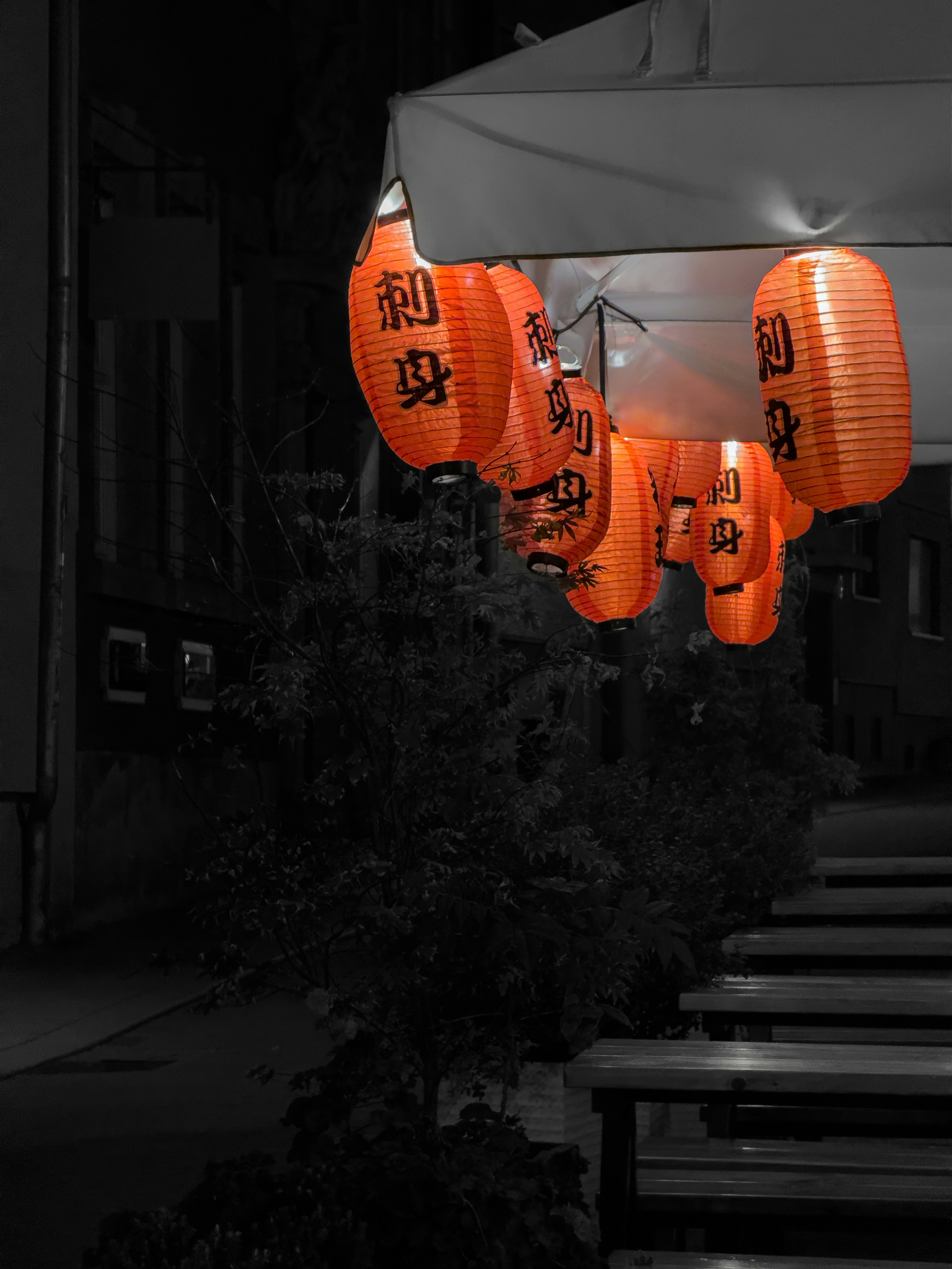 Illuminated Lanterns in a Shadowed Alley