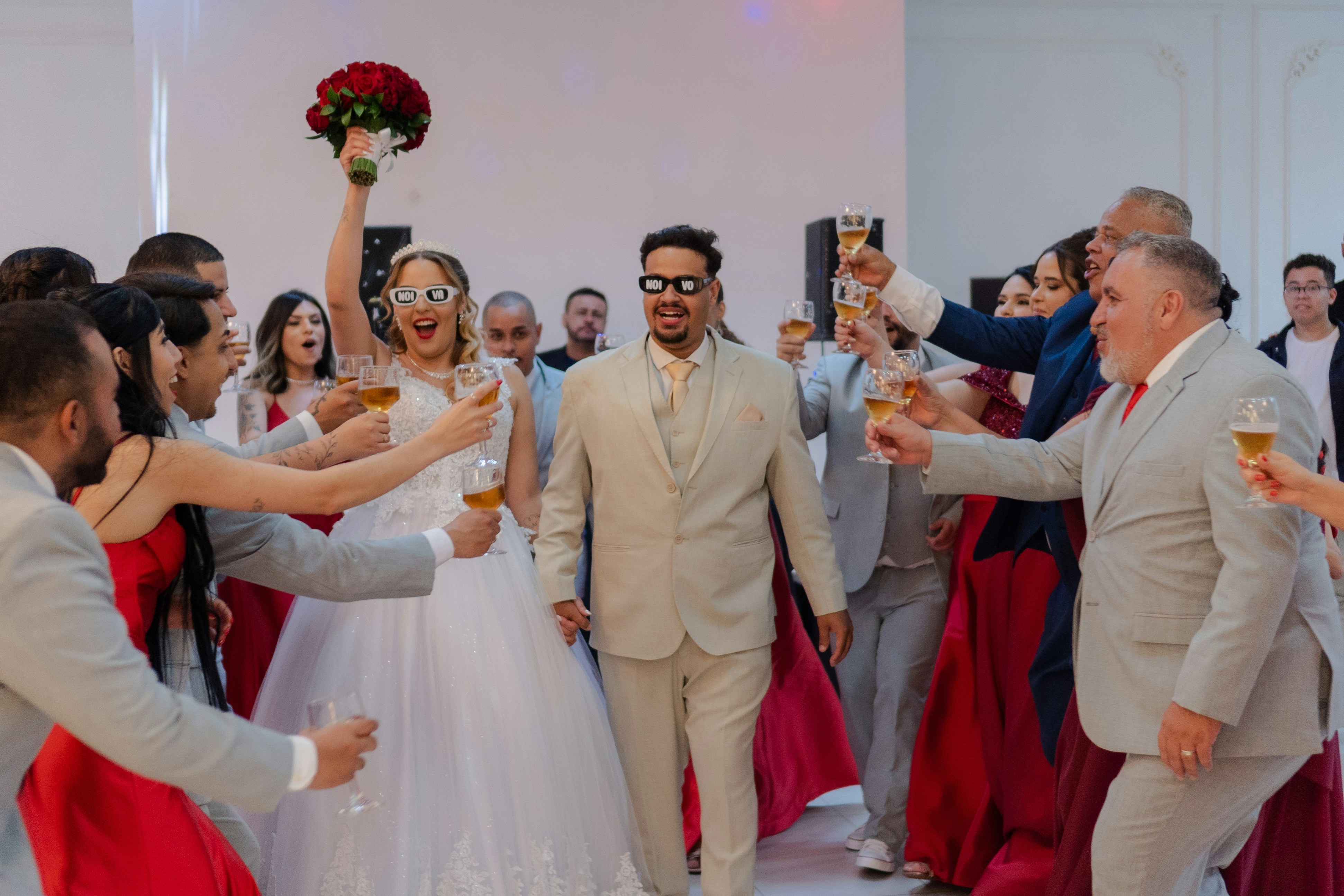 Mid-wedding jubilee: Newlyweds lead a toast-filled procession