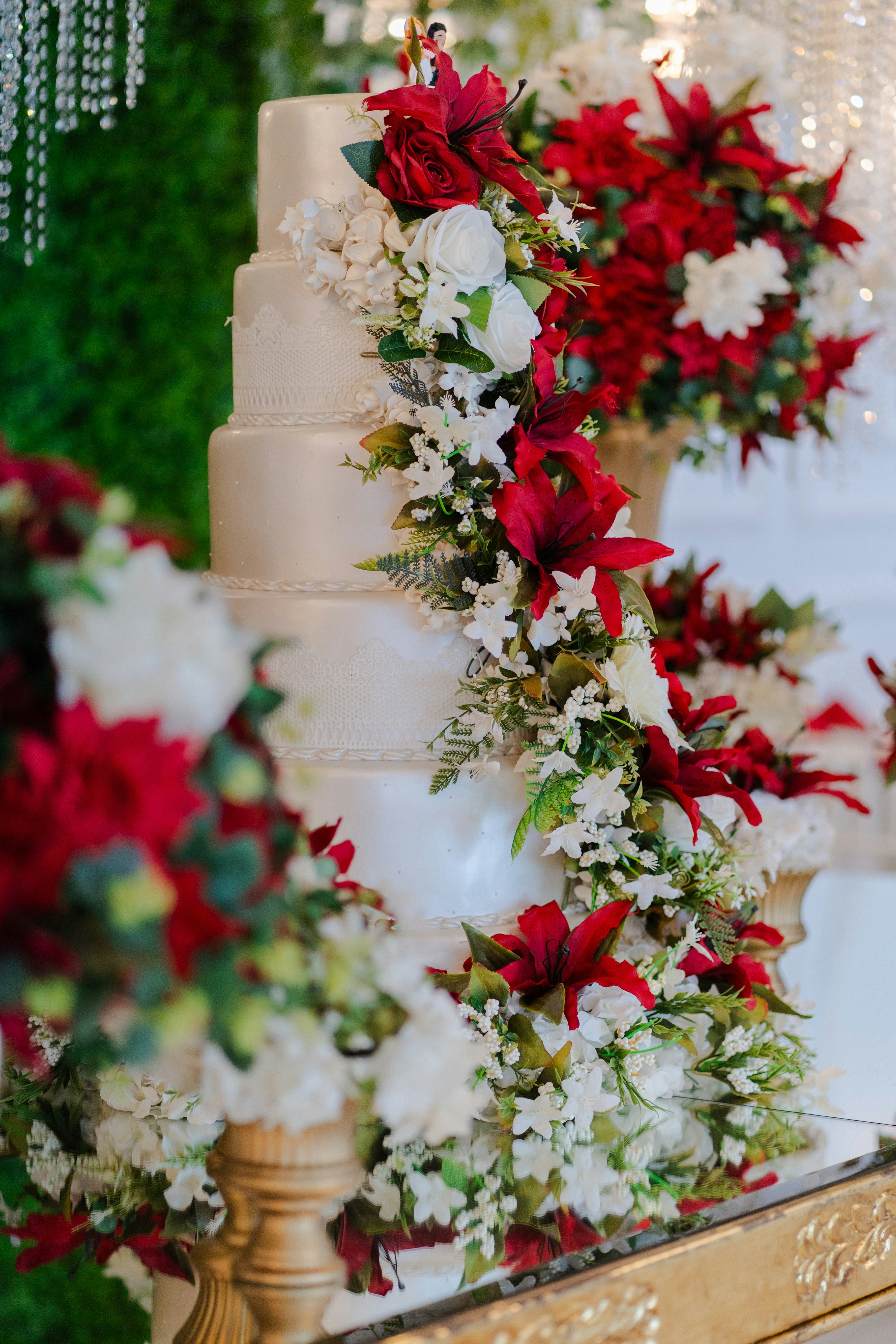 Ivory Tiered Cake Dressed in a Cascade of Red and White Florals