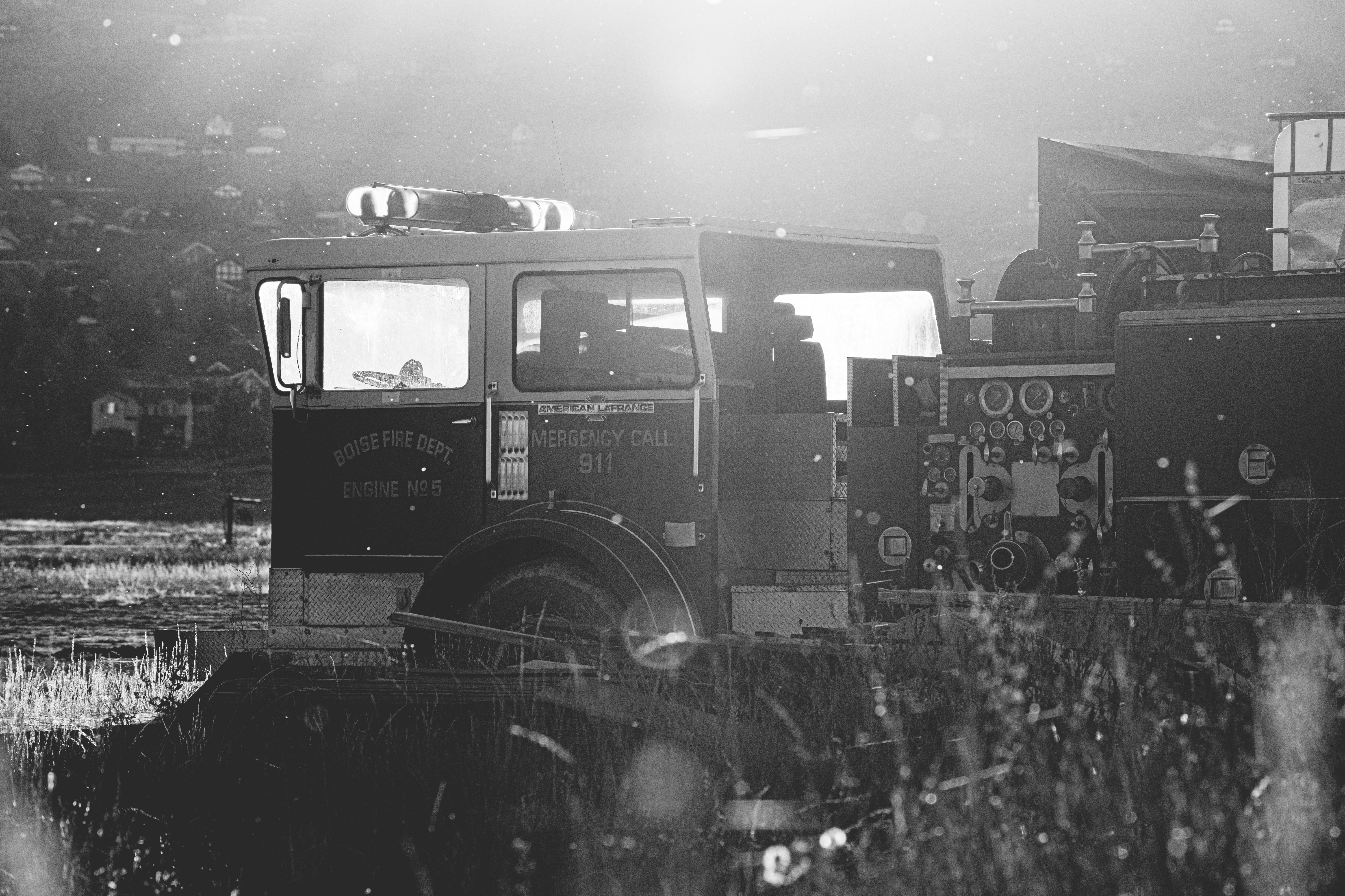 Fire truck parked in a grassy field at dawn. photo – Free Vintage Image ...
