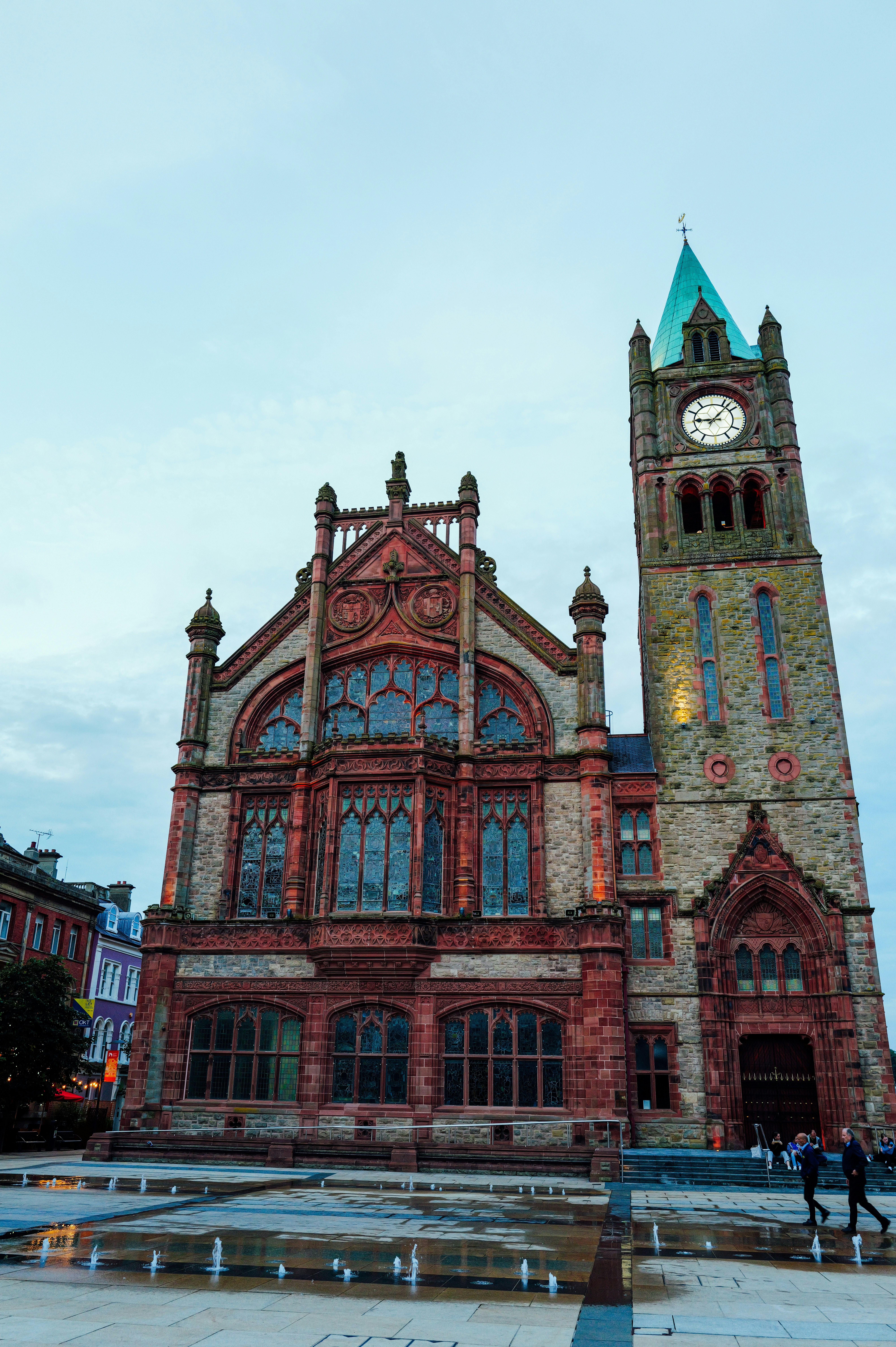 Ornate red stone building with a tall clock tower. photo – Free ...