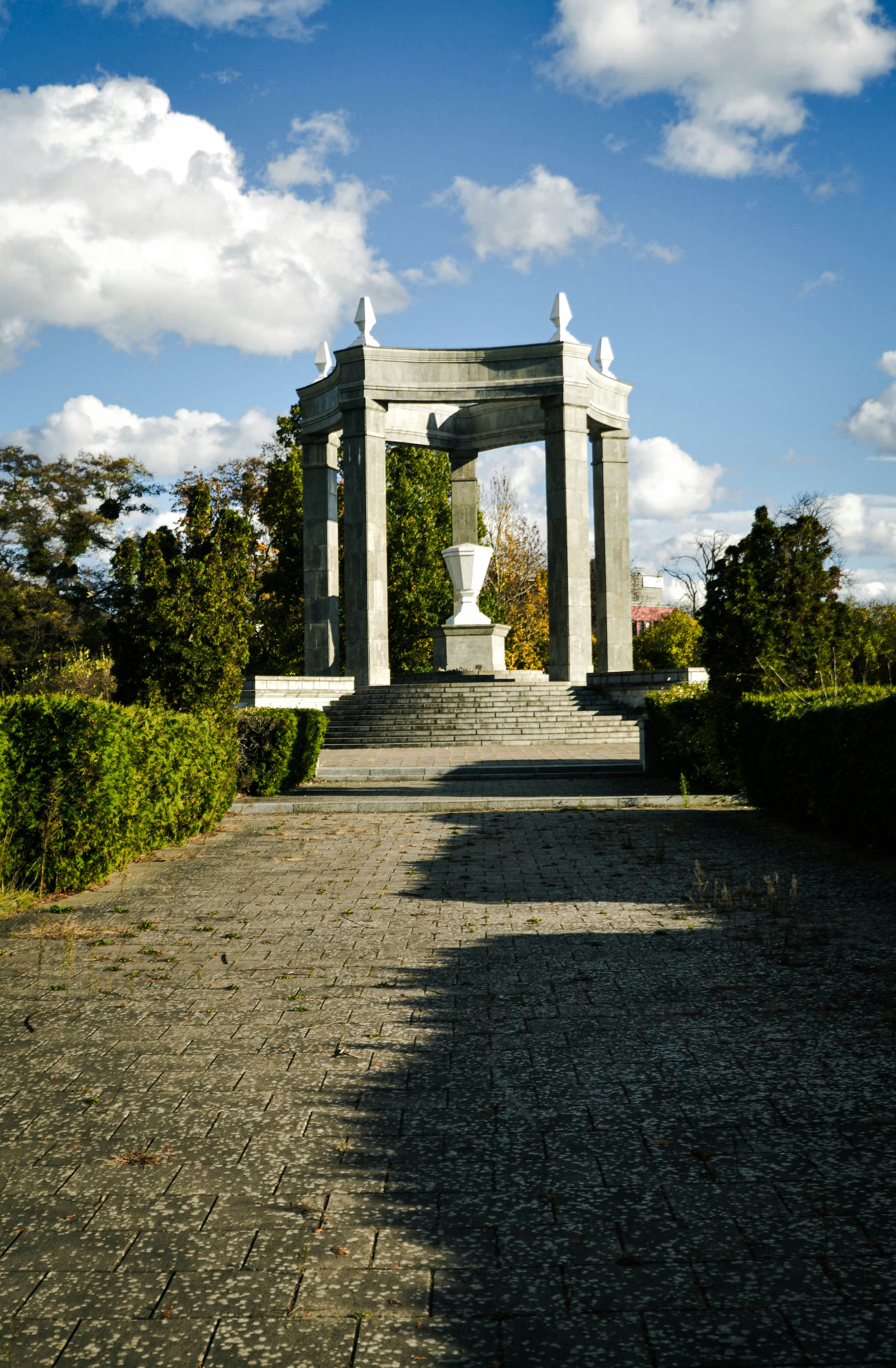 Monument with urn in a park on a sunny day