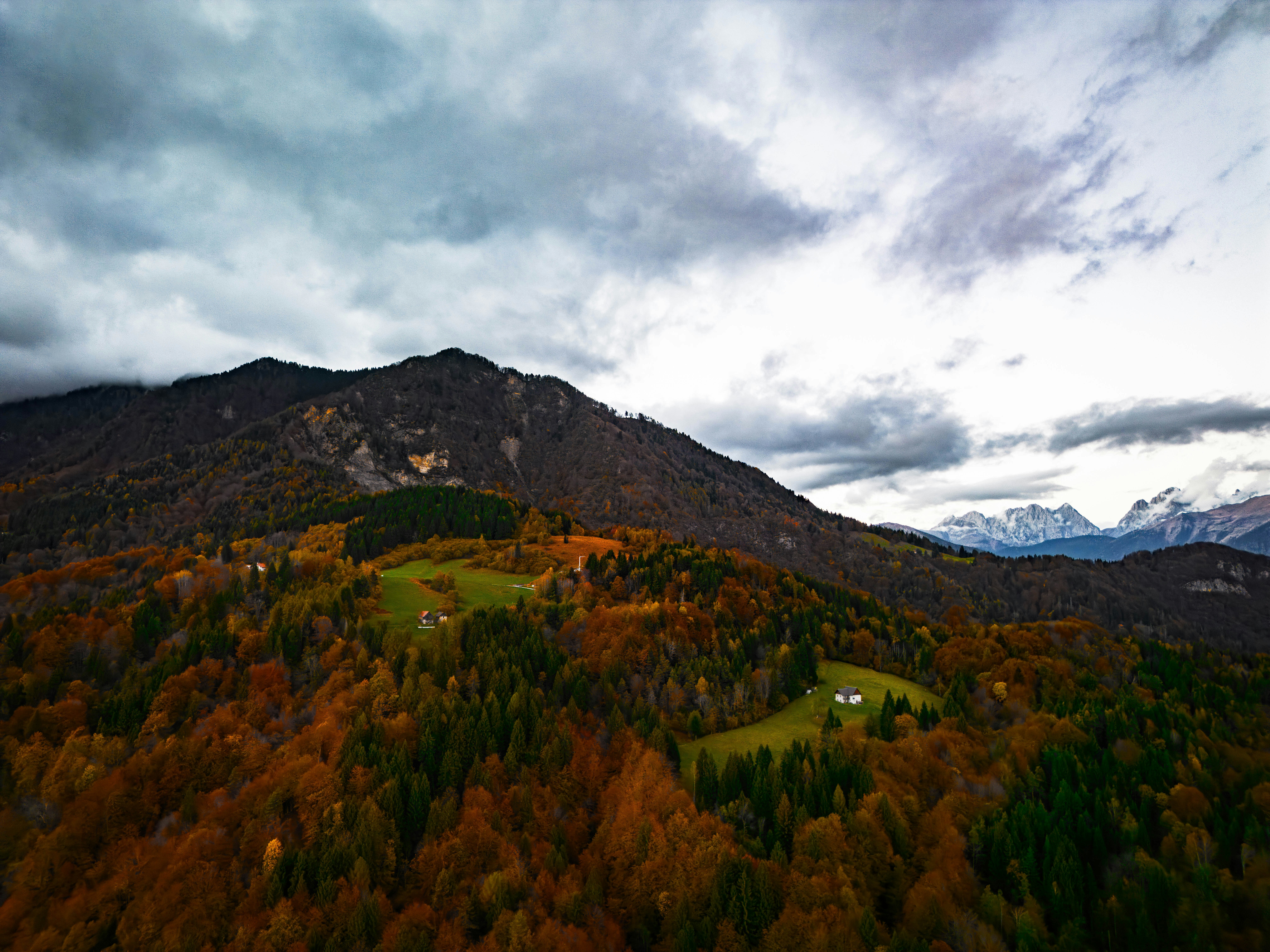 Autumn's Embrace Over Verdant Valleys