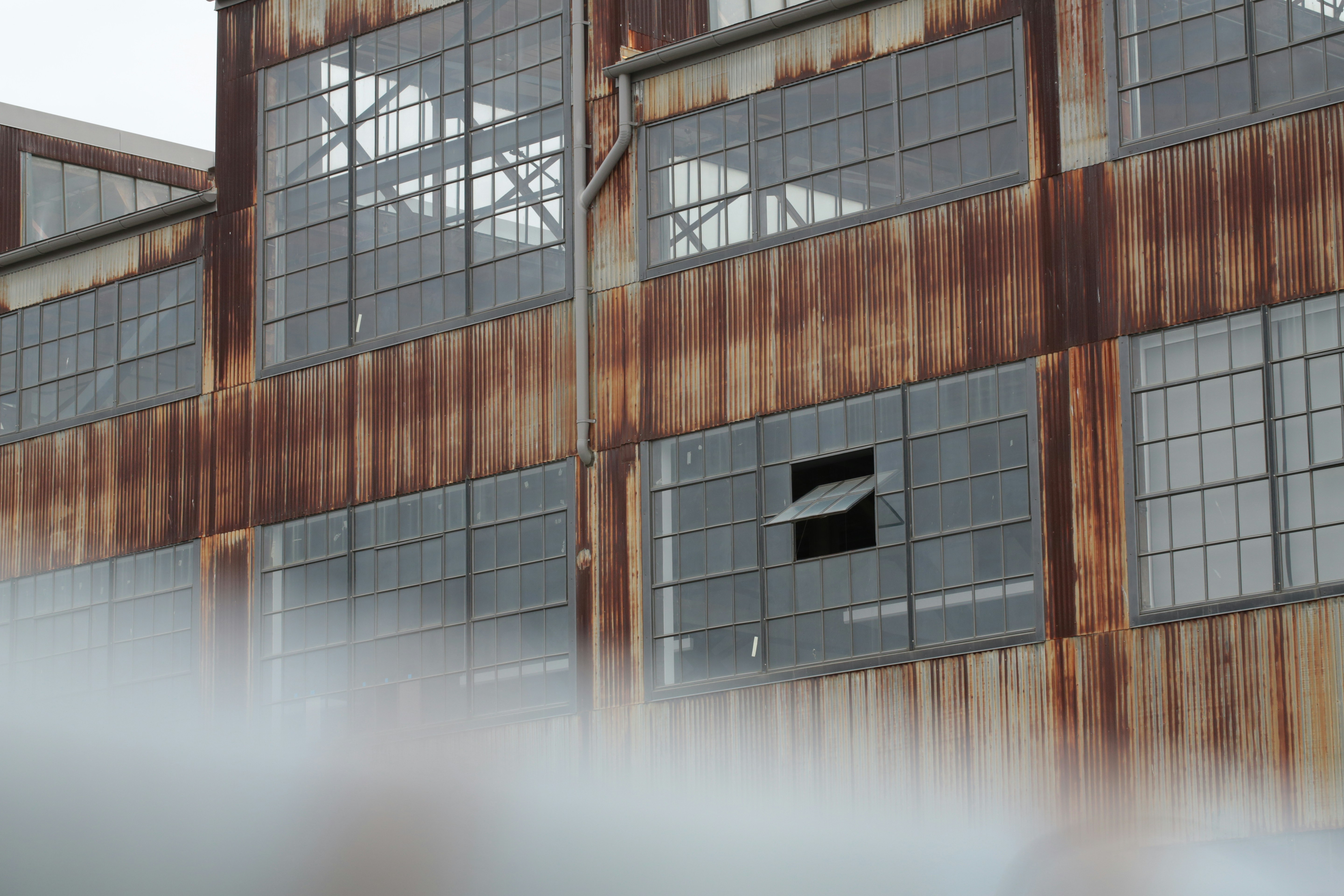 Rusty industrial building with many windows photo – Free Factory Image ...