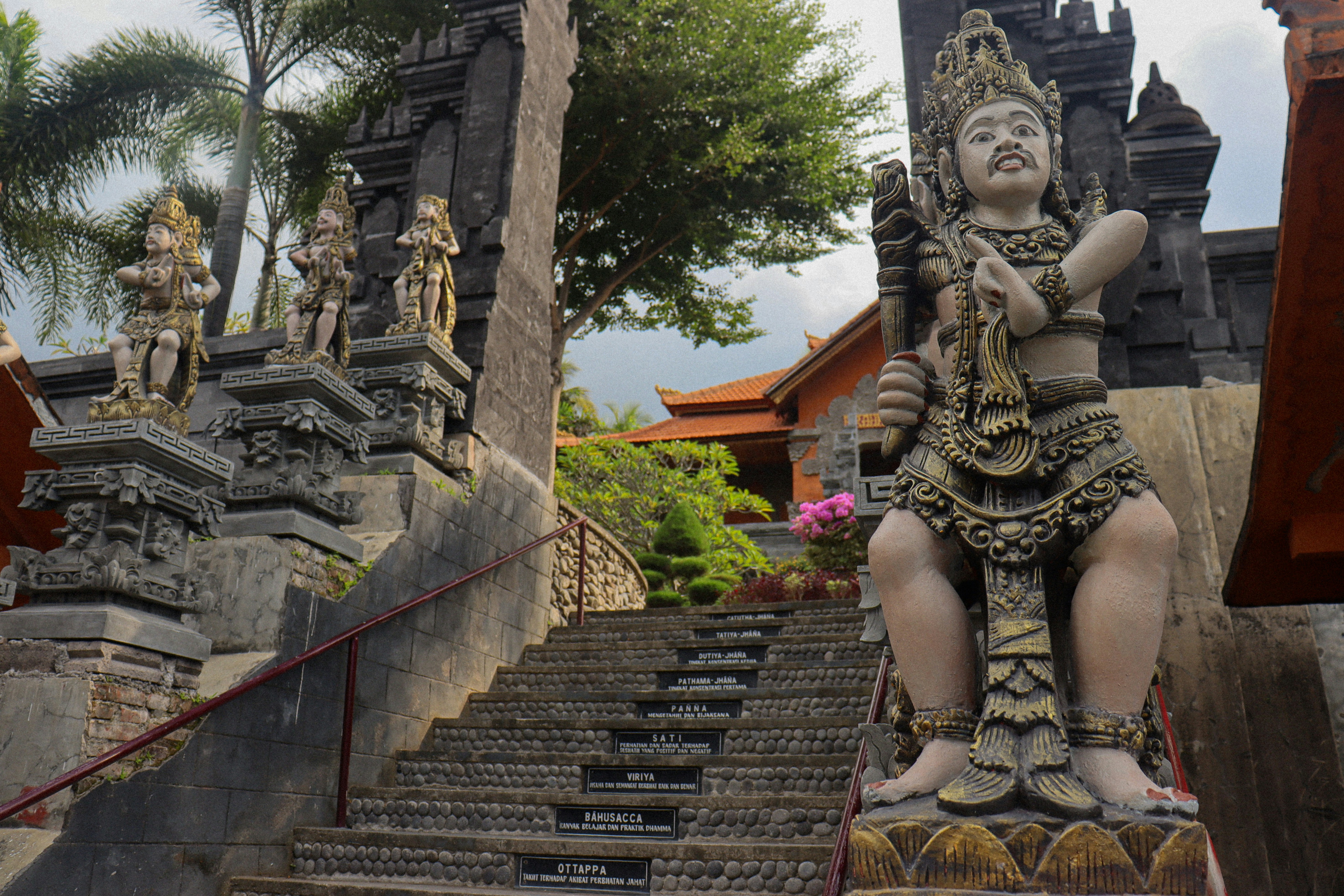 Stone Sentinel on Balinese Steps: Temple Guardian in Carved Glory