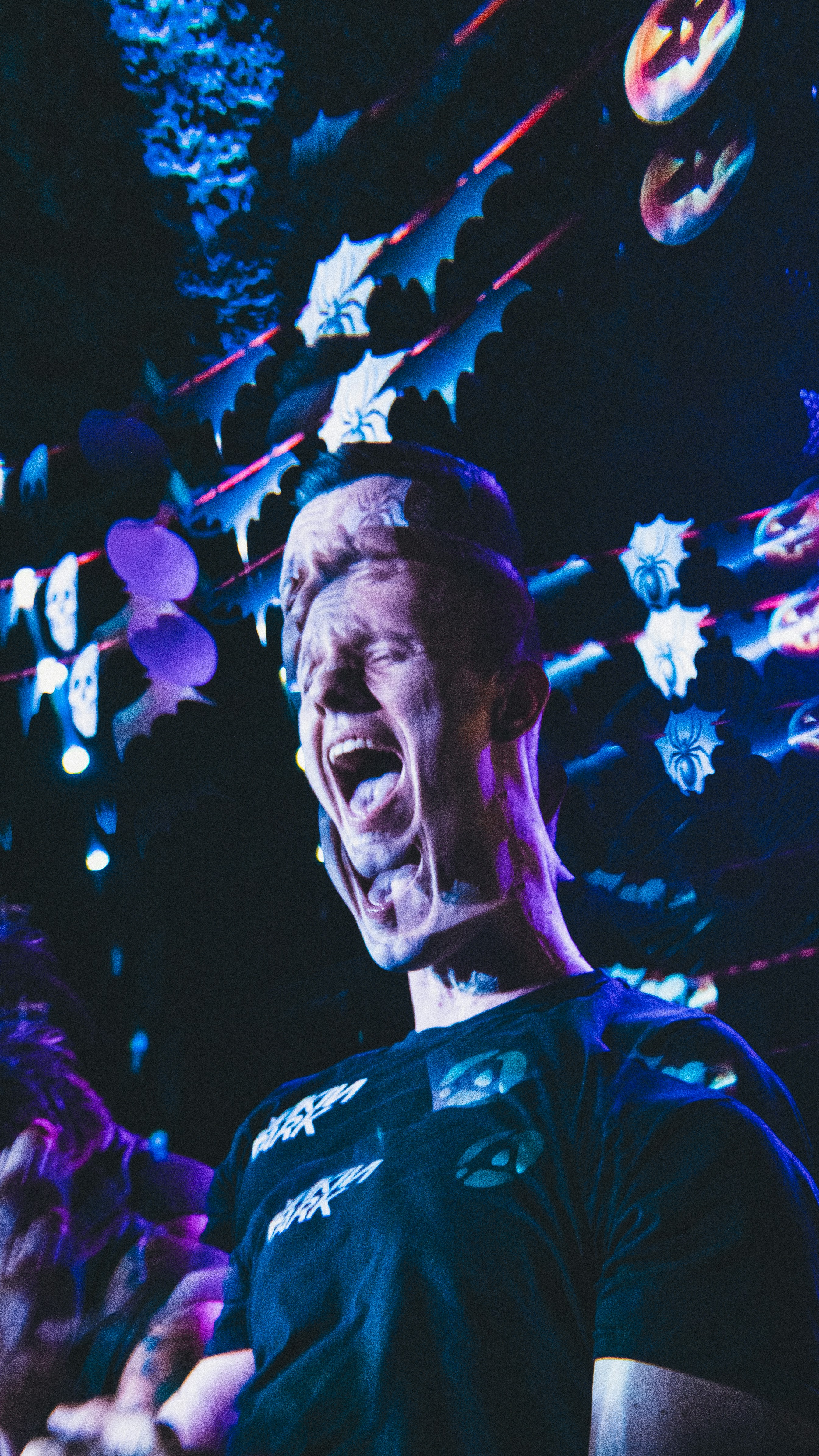 Neon Scream Beneath a Bat-Lined Stage