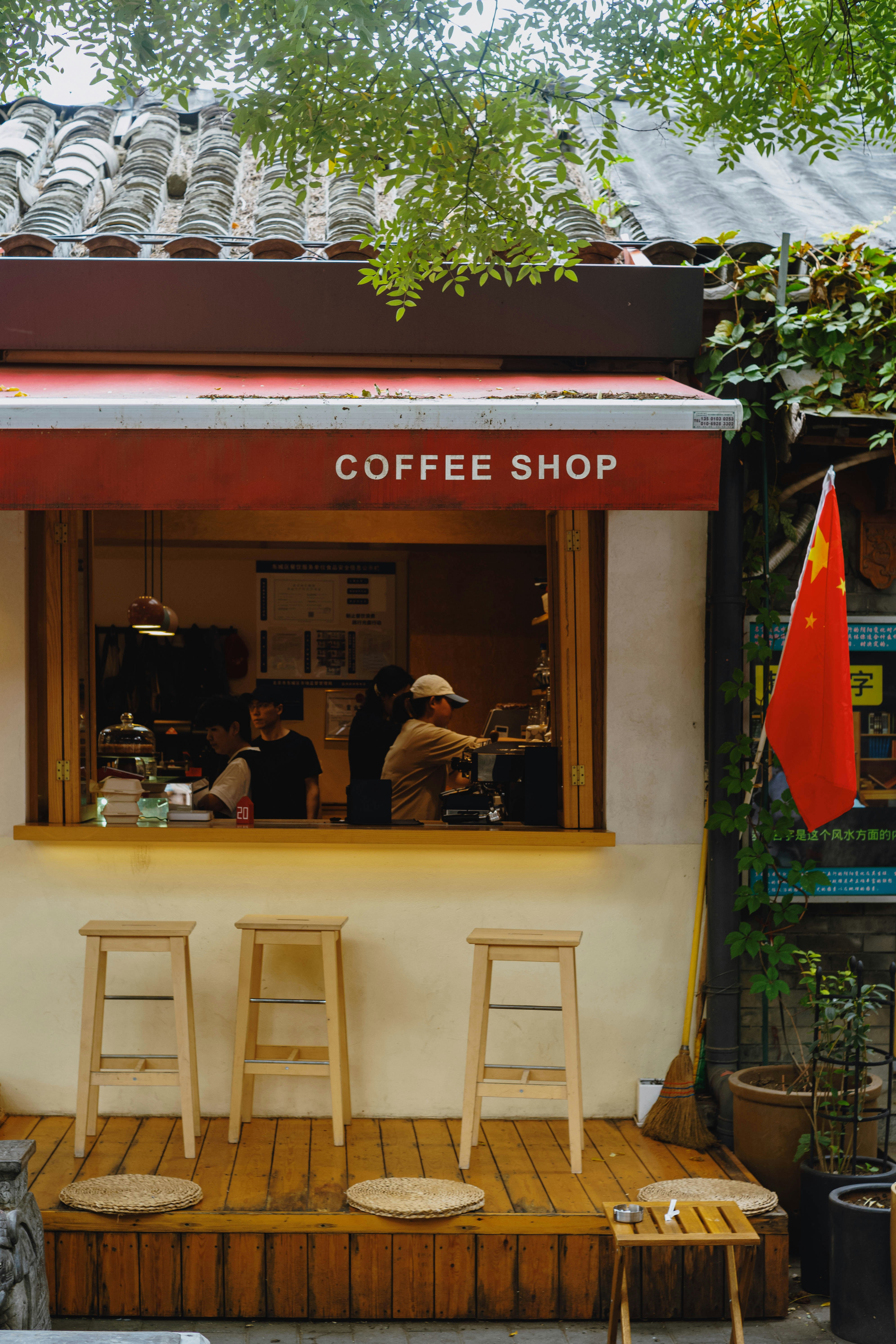 Coffee shop with baristas and outdoor seating photo – Free Cafe Image ...