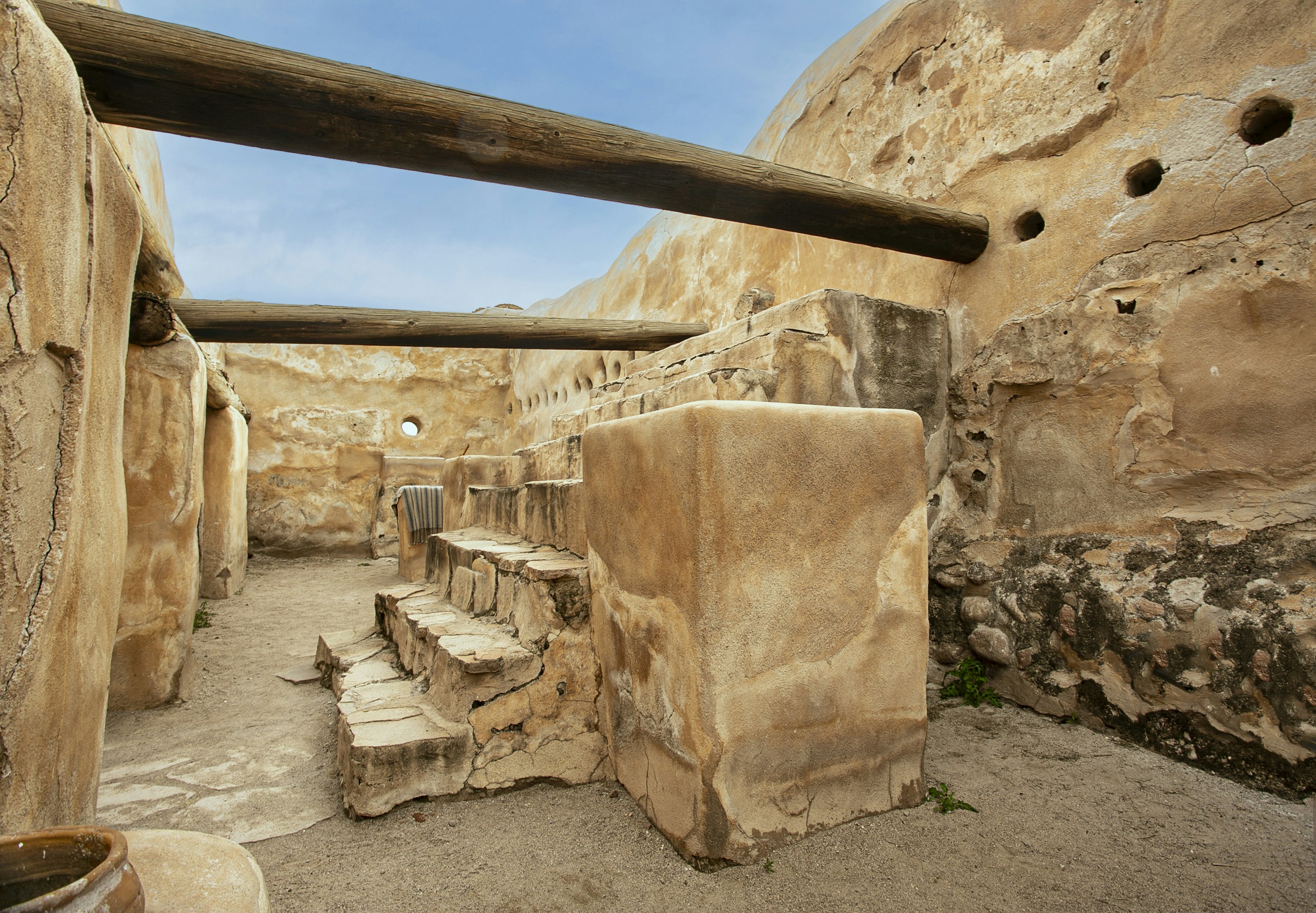 Tumacacori National Monument | Ancient stone ruins with wooden beams and stairs