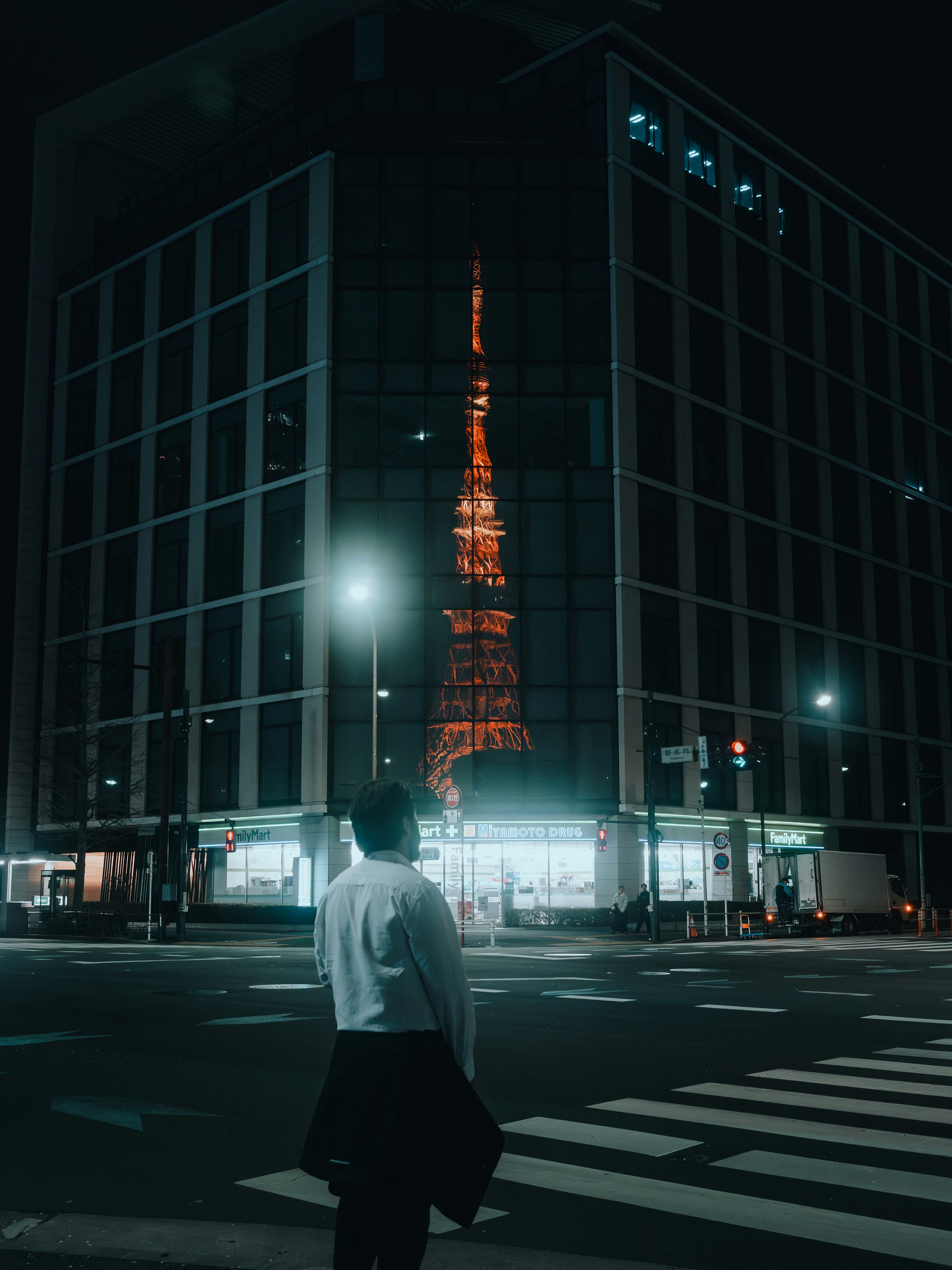 Check out my instagram - @sebastiandugudae | Person looking at tokyo tower reflection at night