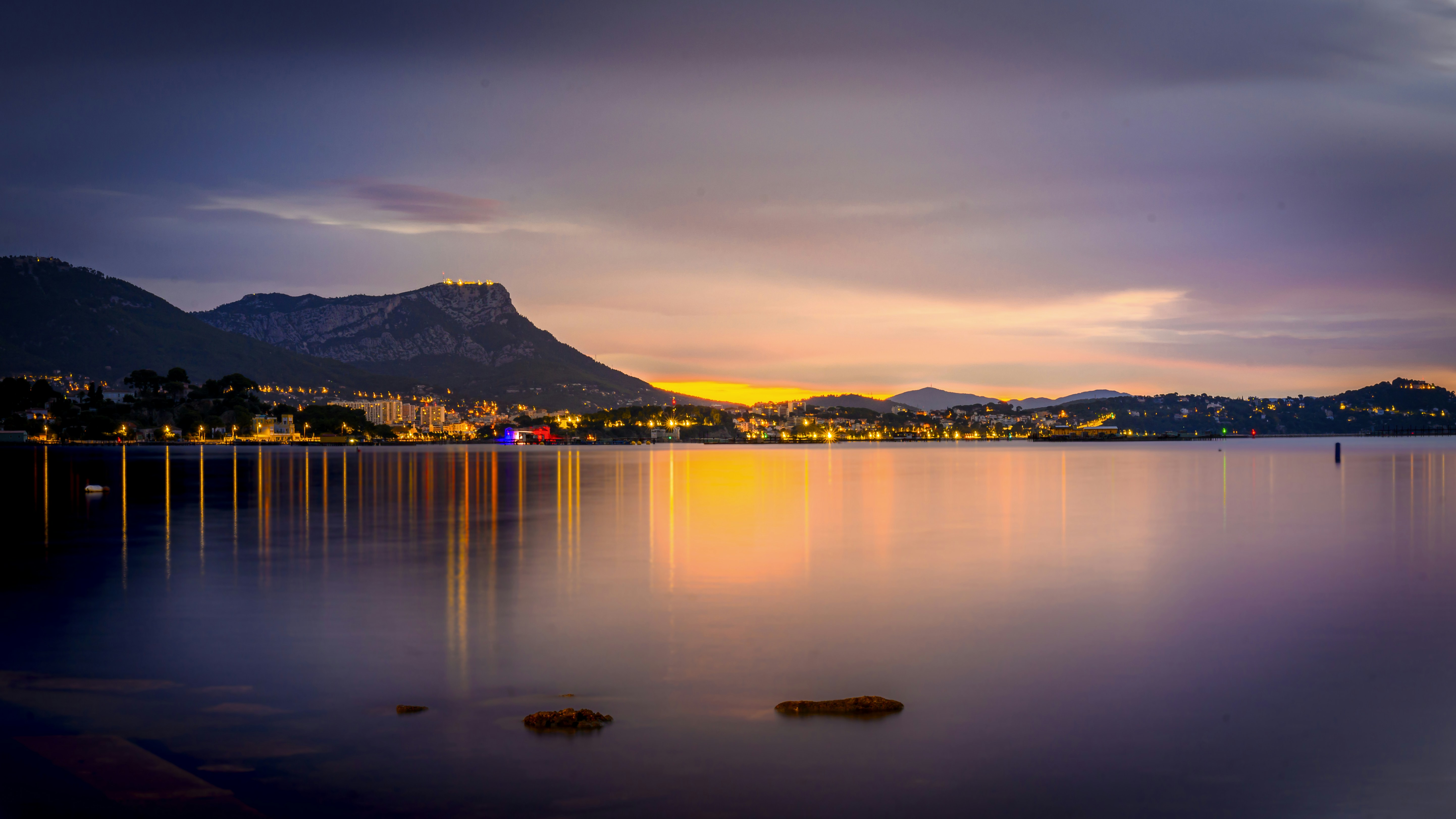 Twilight Reflections Over Tranquil Waters