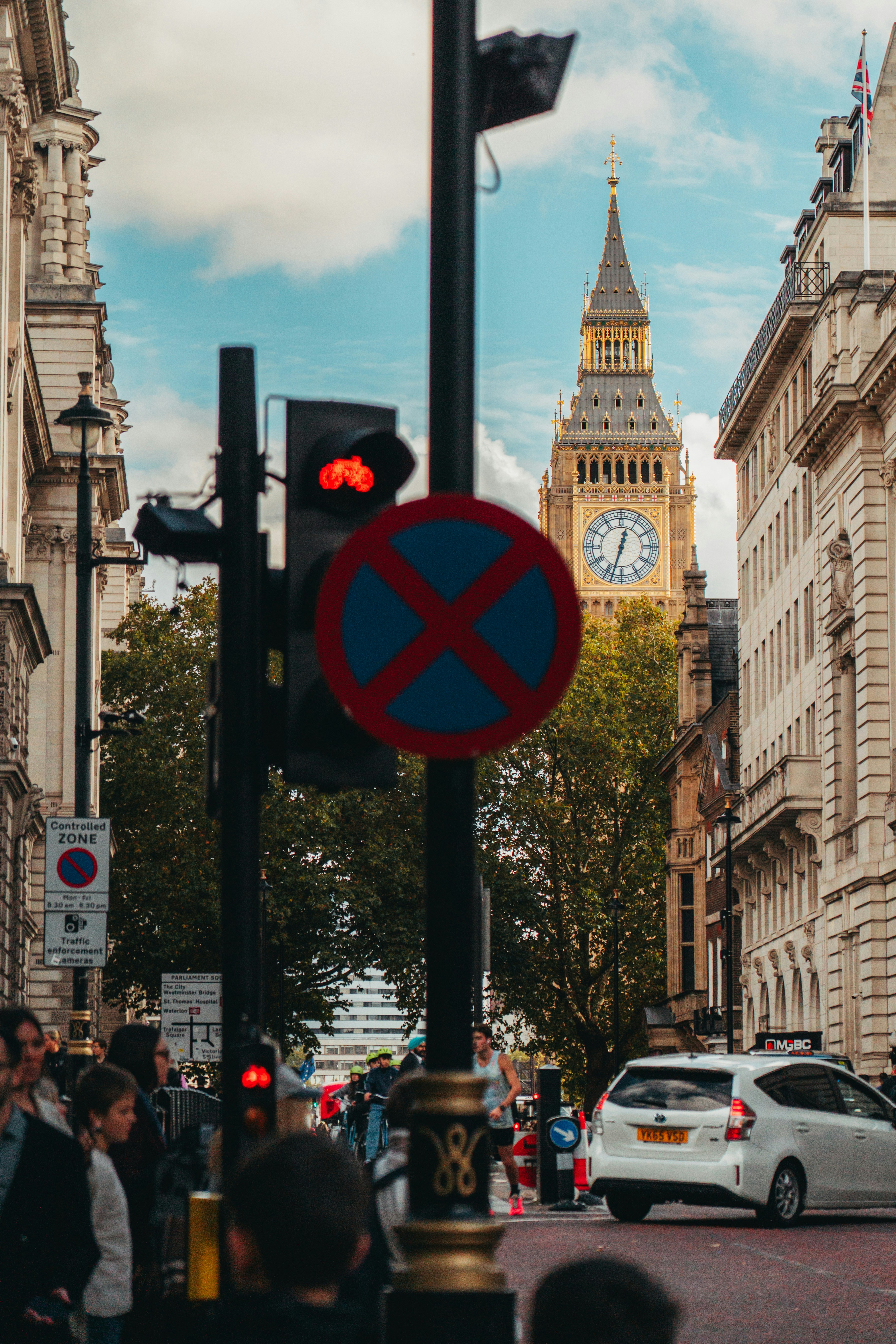 Big ben clock tower visible through city street