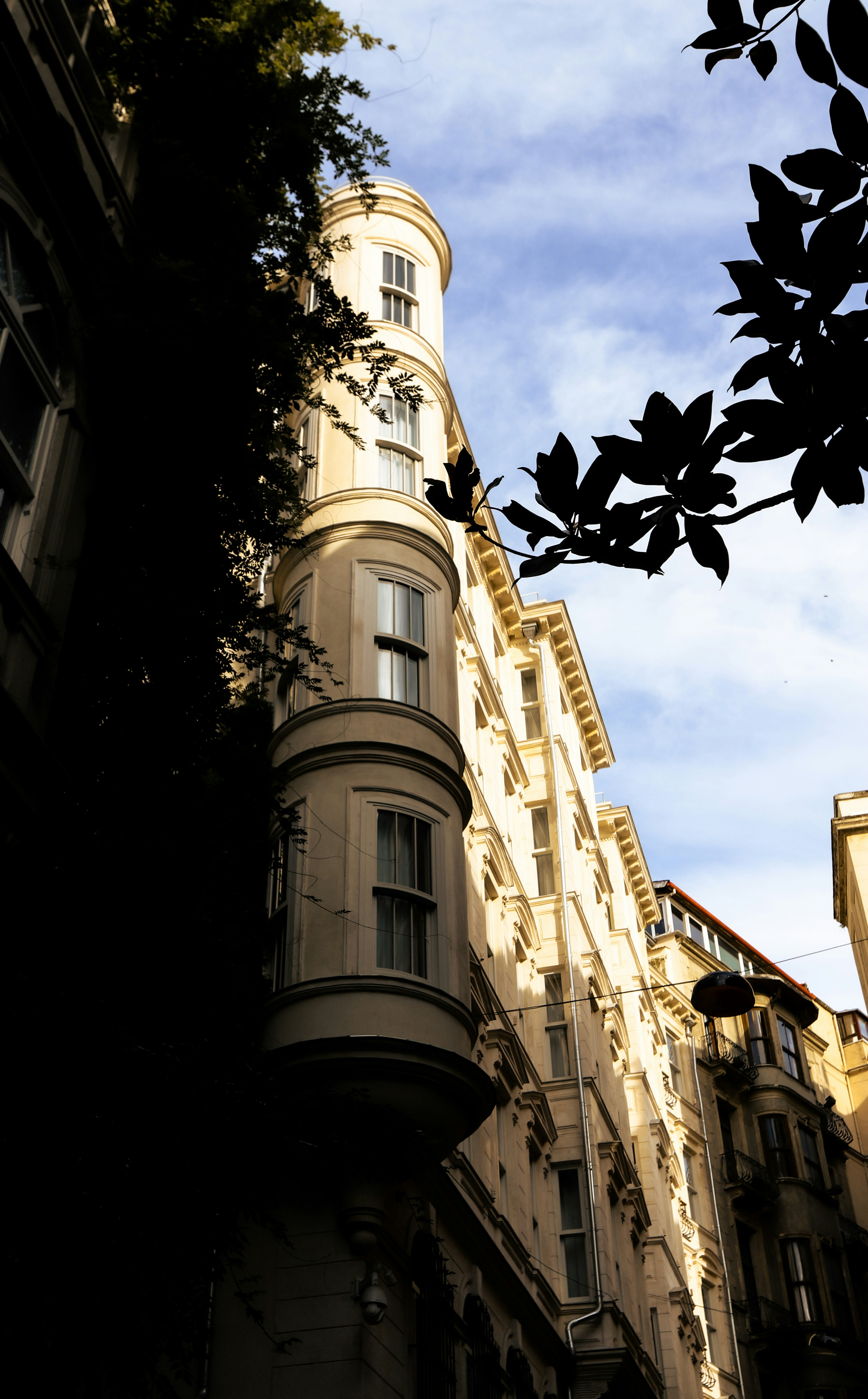 Ornate building with a turret against a blue sky