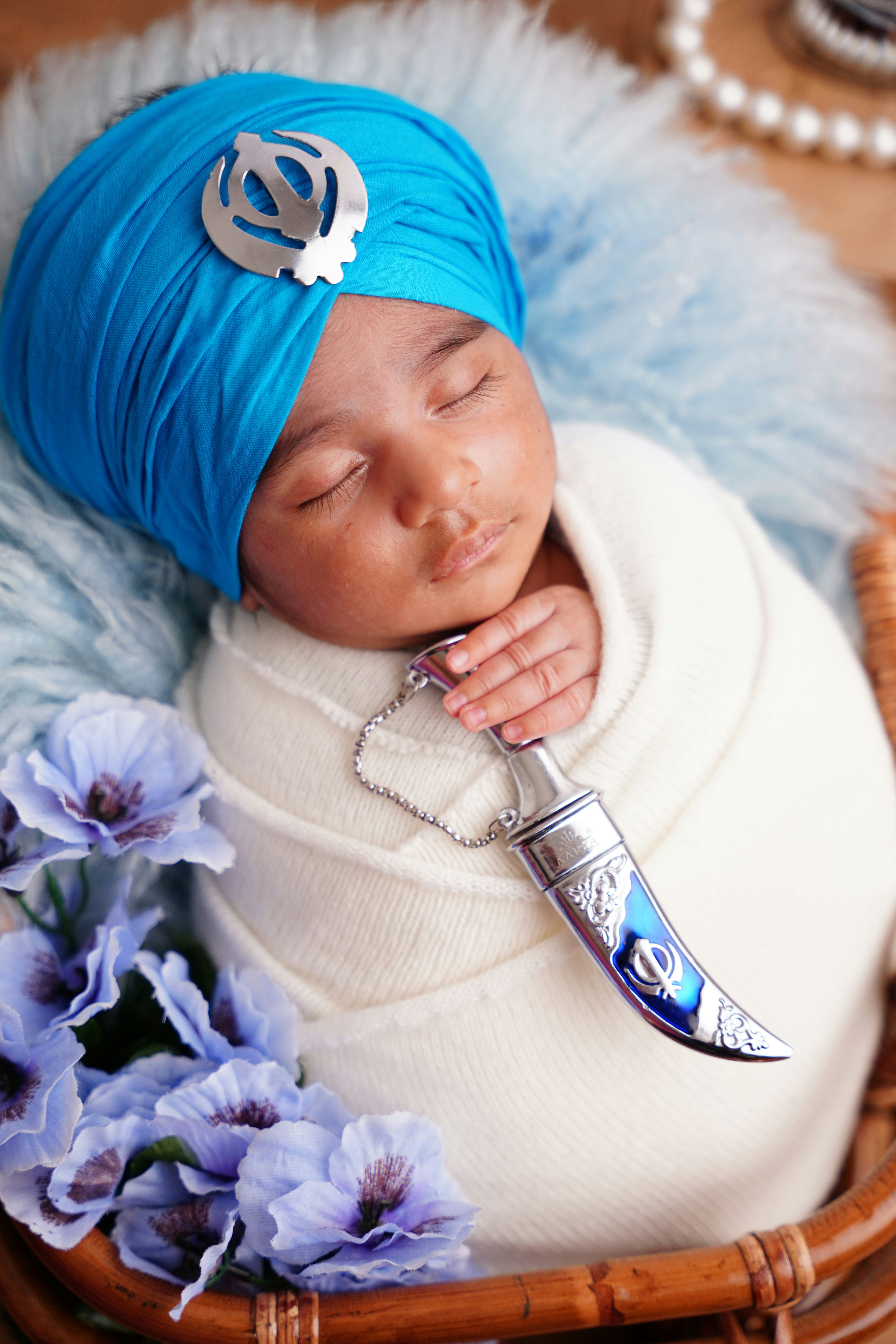 Azure Turban, Moonblade Pendant: A Sleeping Infant in a Wicker Nest