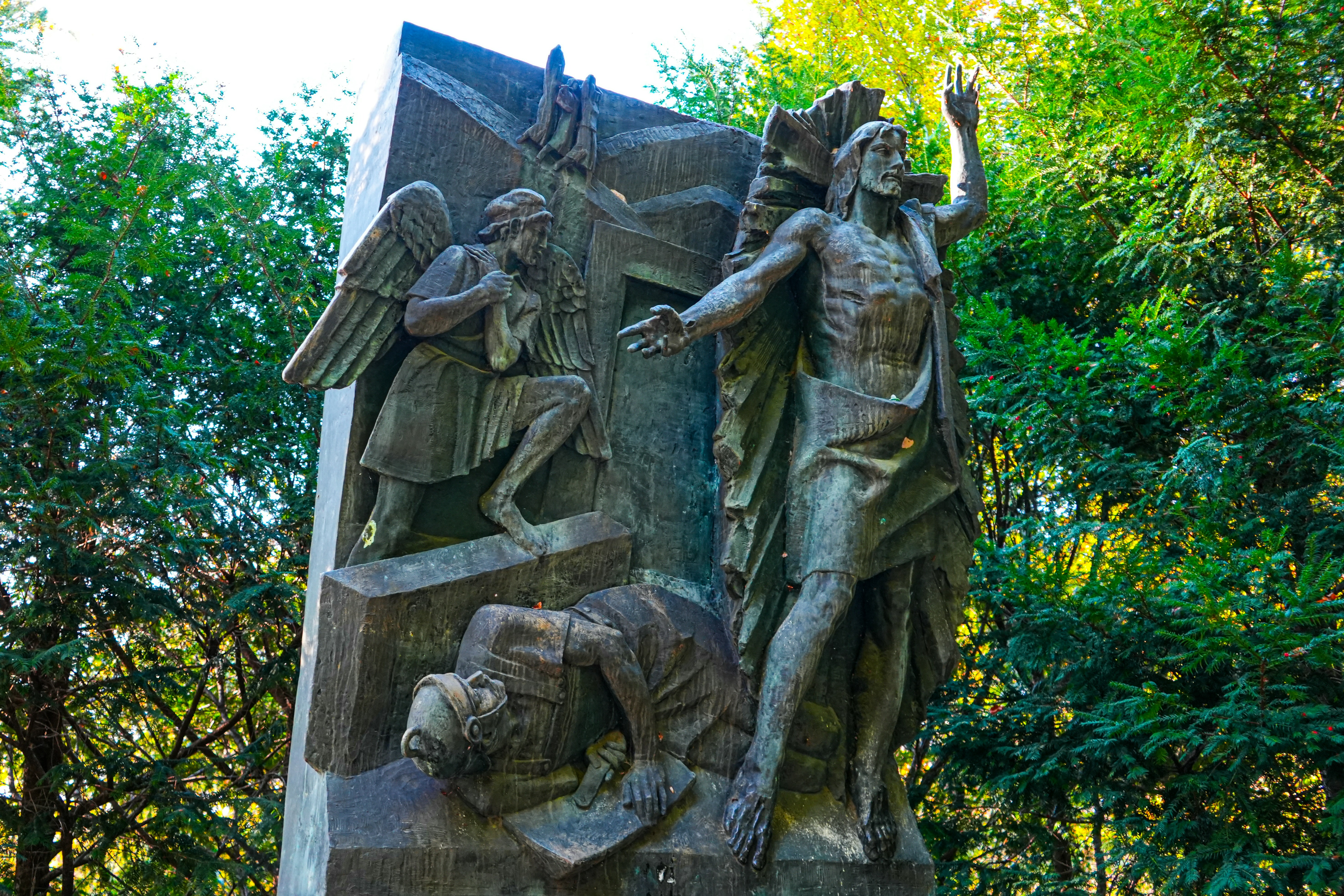 Bronze sculpture depicting biblical scene with angels and figures.