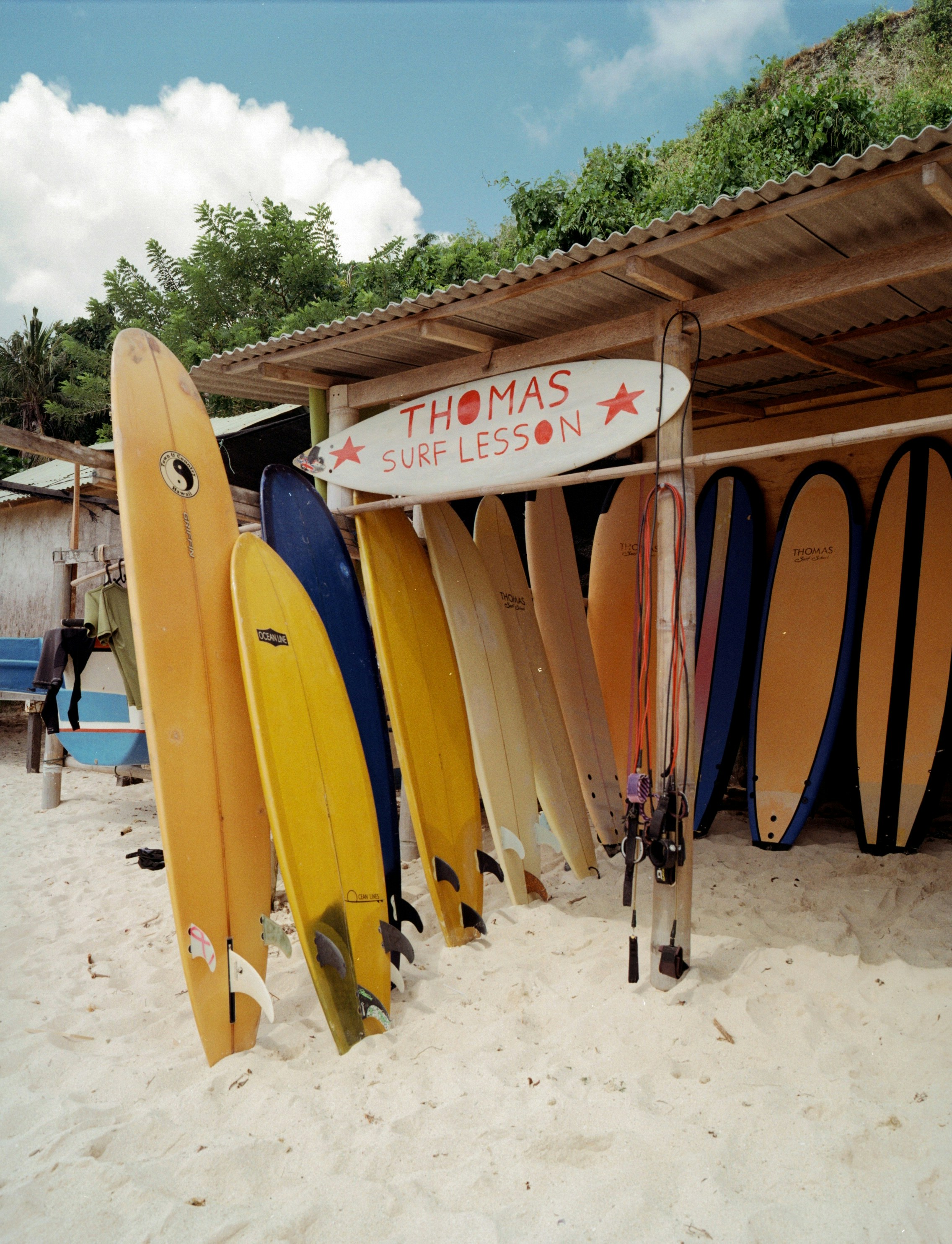 Kodak Gold 200 🎞️ | Surfboards lined up outside a beachside shack