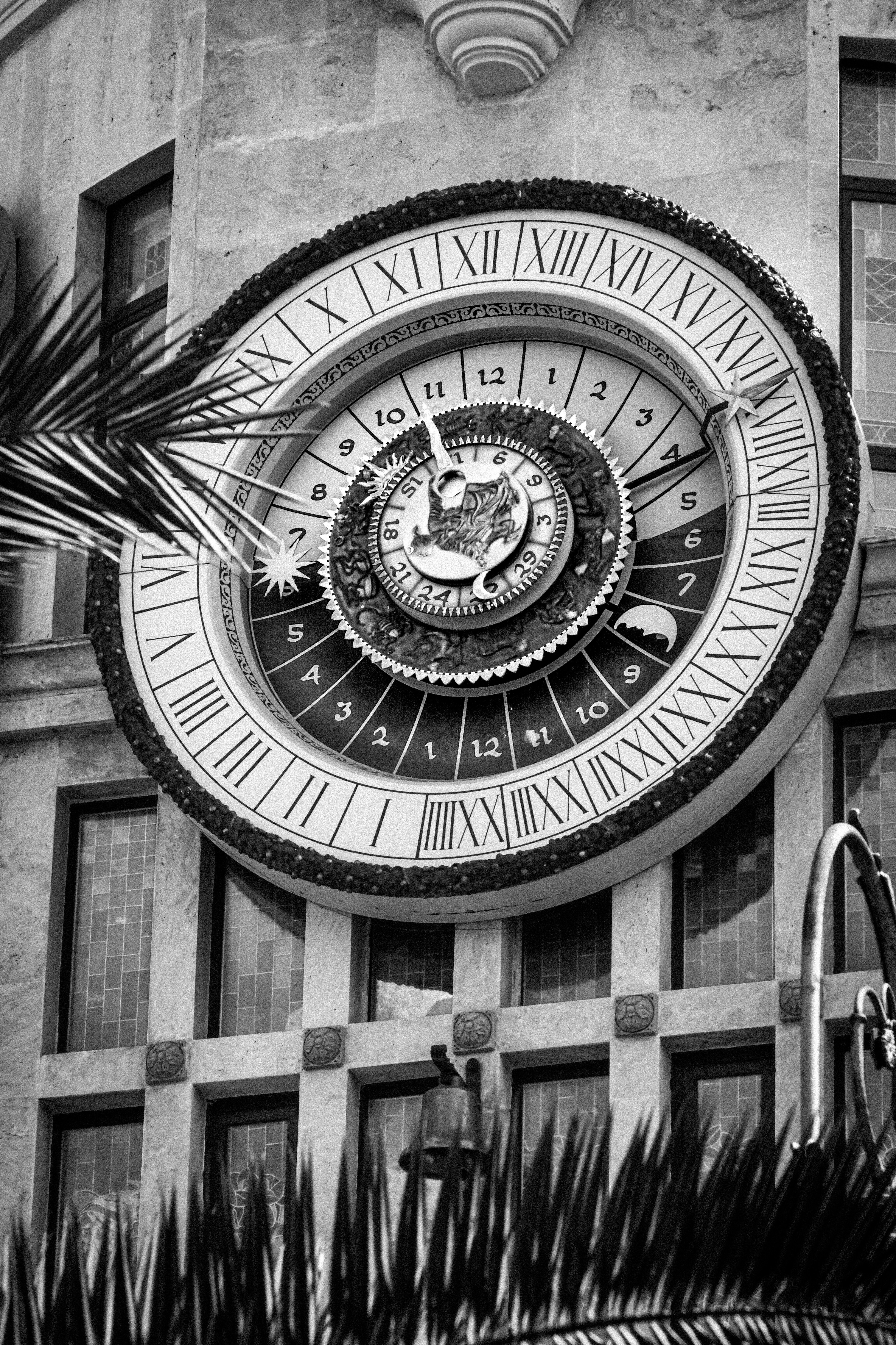 Ornate astronomical clock on building facade