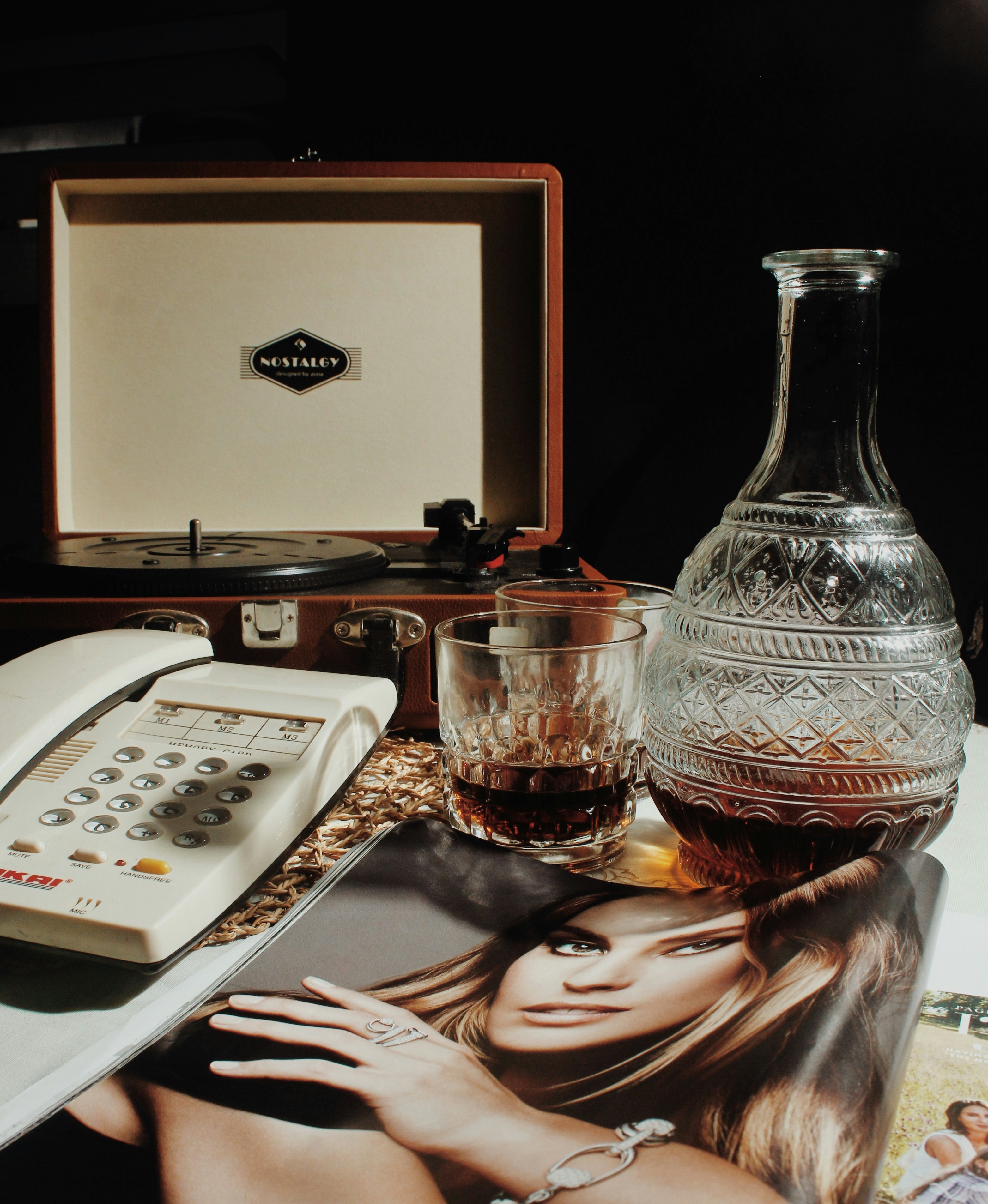 FOREWORD. Shot by OUR LORD BISHOP. Creative direction: ODN, and OLB. | Vintage record player, decanter, and telephone on table.