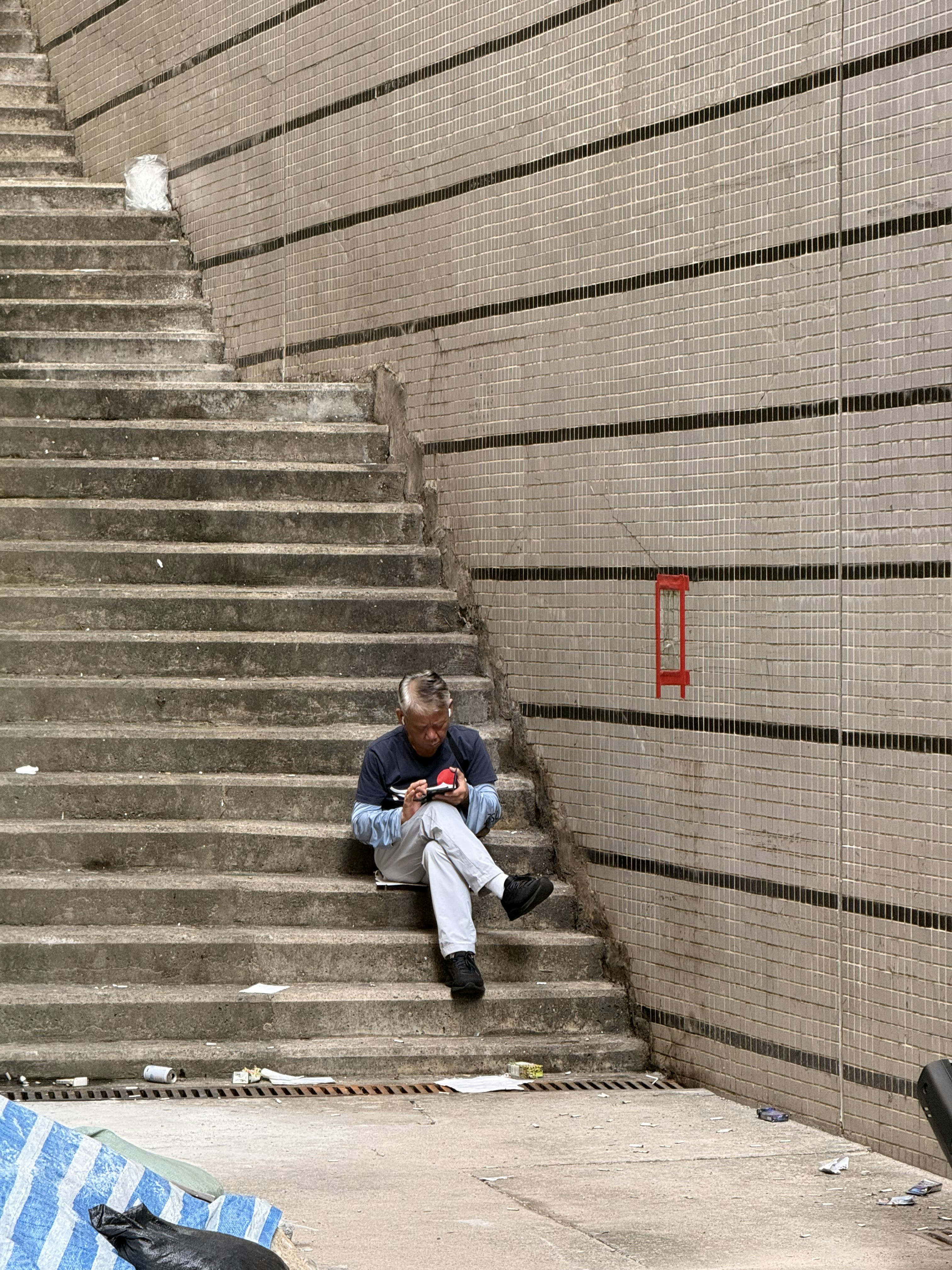 Urban Solitude: A Moment on the Stairs