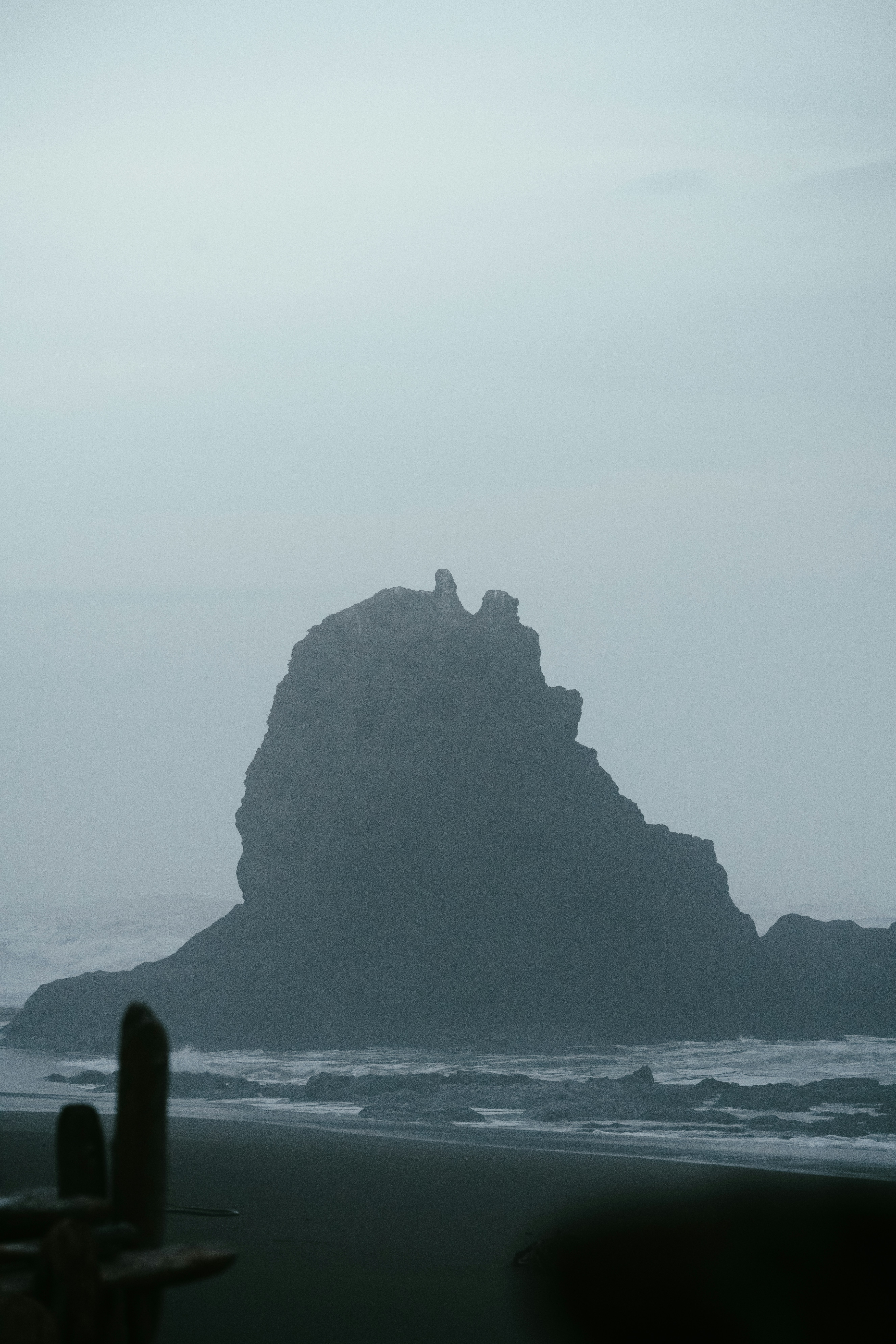 Misty Monolith: Nature's Silent Sentinel