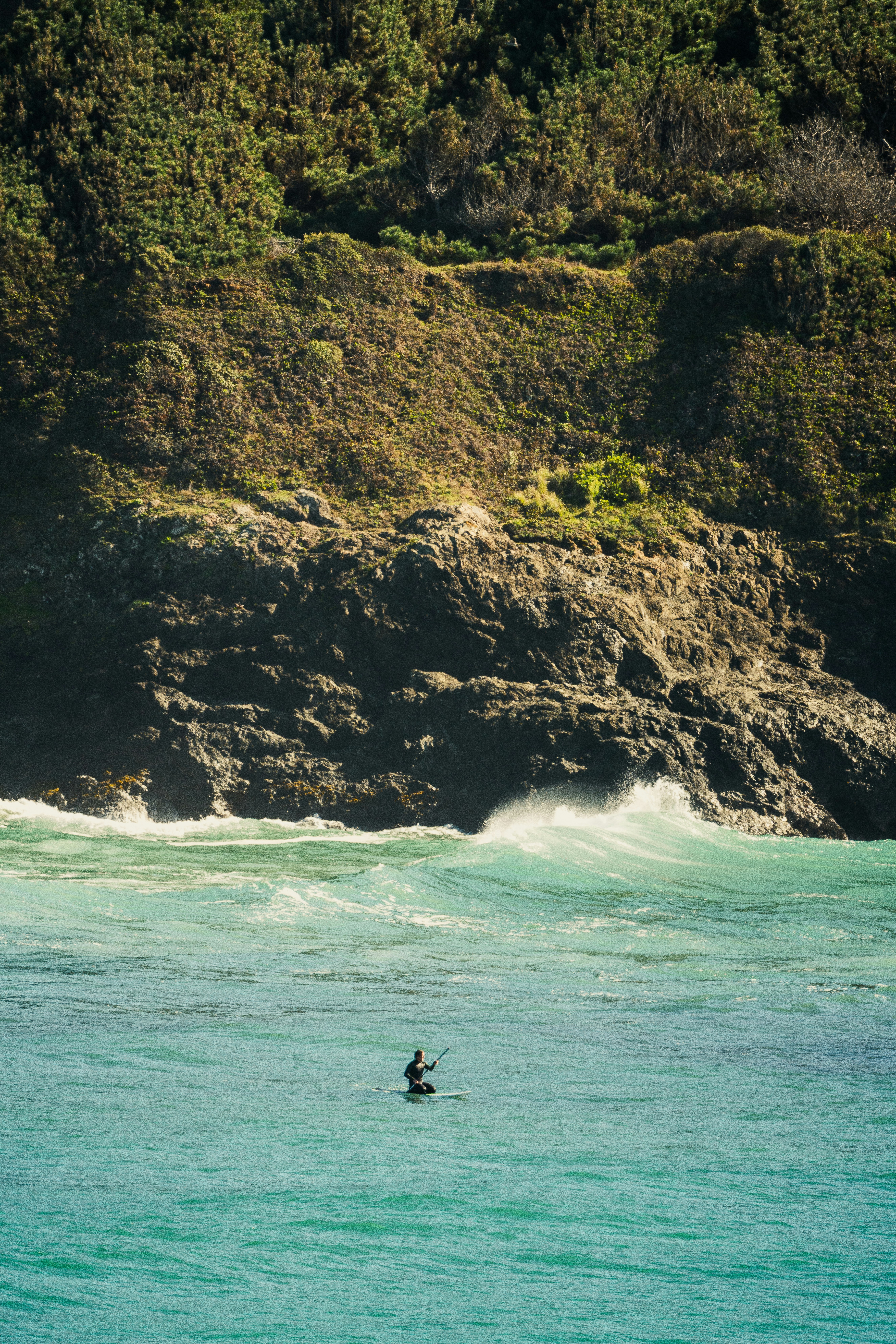 Harmony of Water and Stone: A Surfer's Solitude