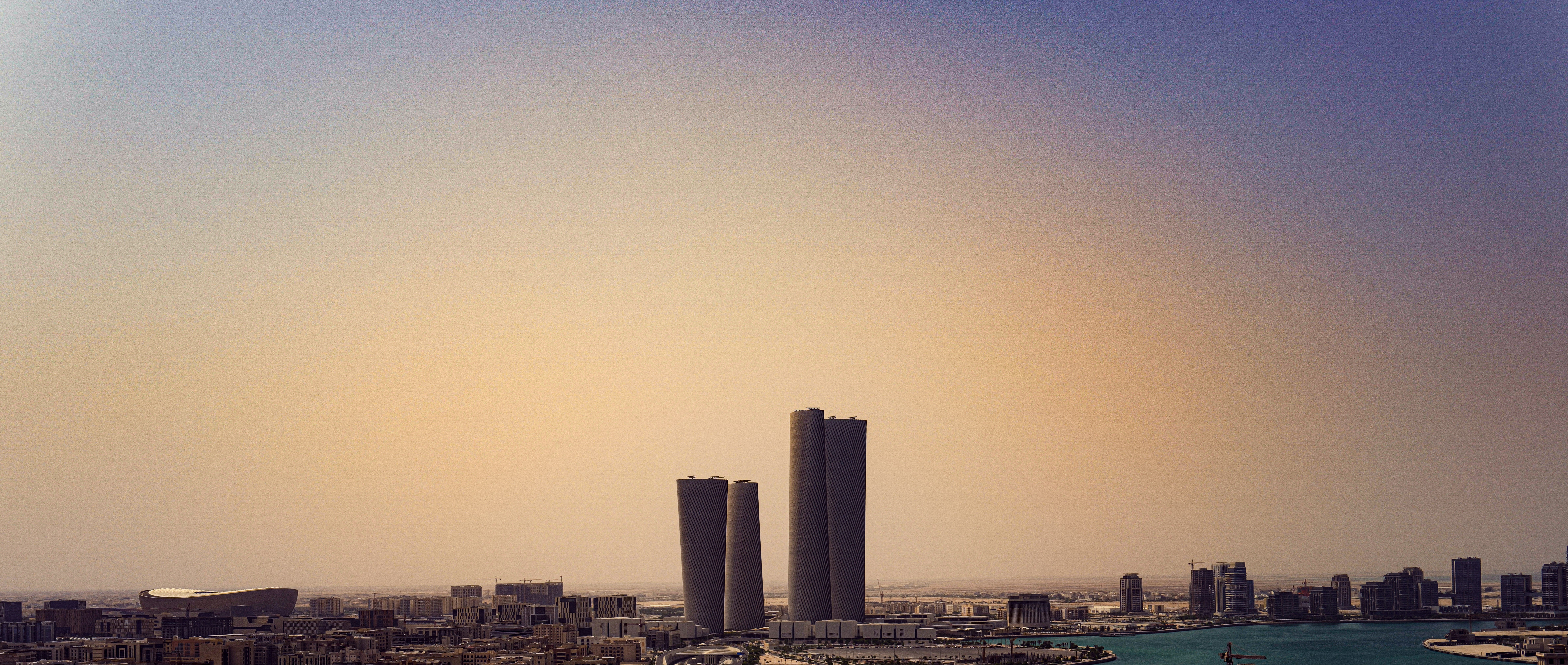 City skyline with modern skyscrapers at dusk