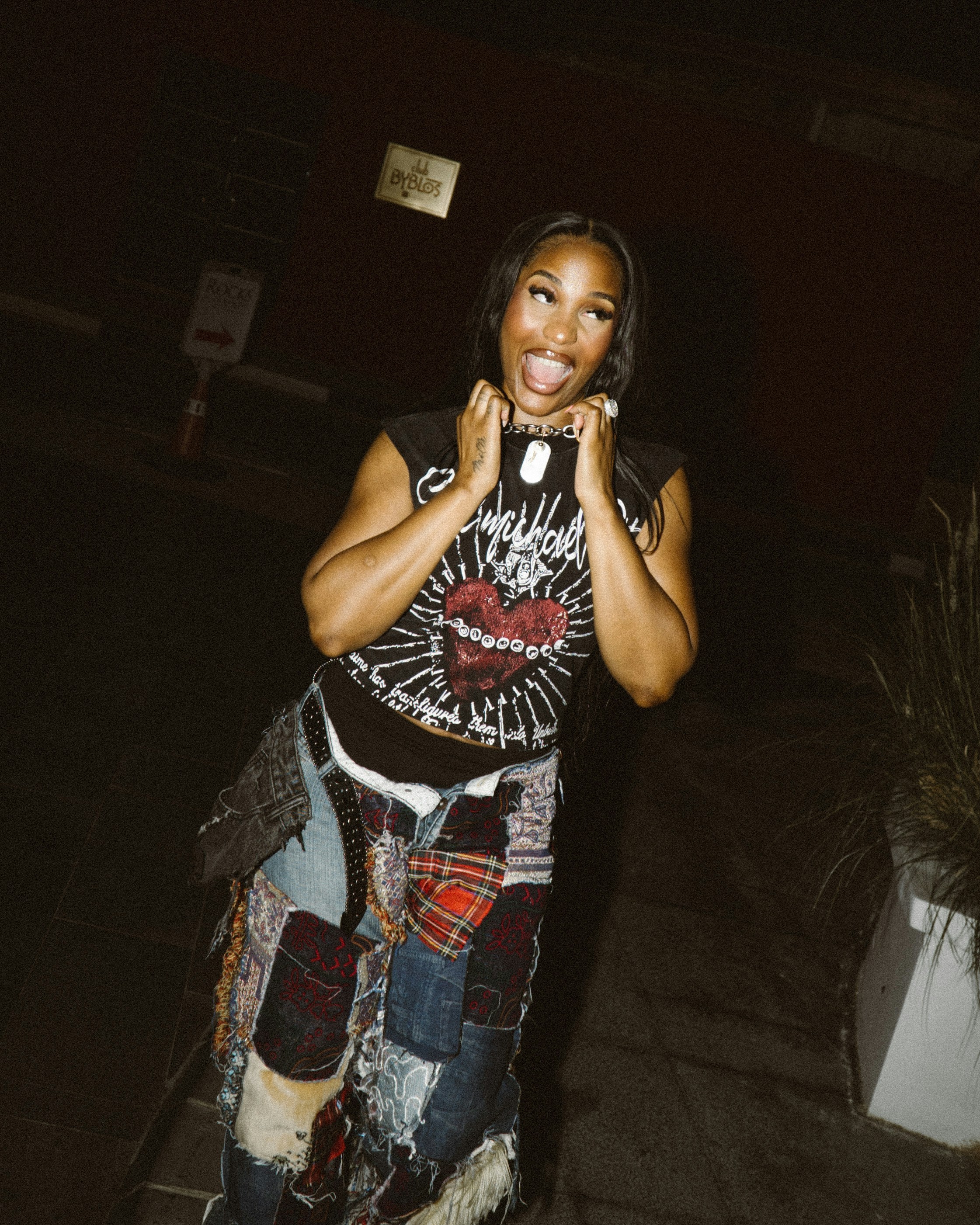 Patchwork Pulse: A Jubilant Backstage Portrait in Mixed Denim