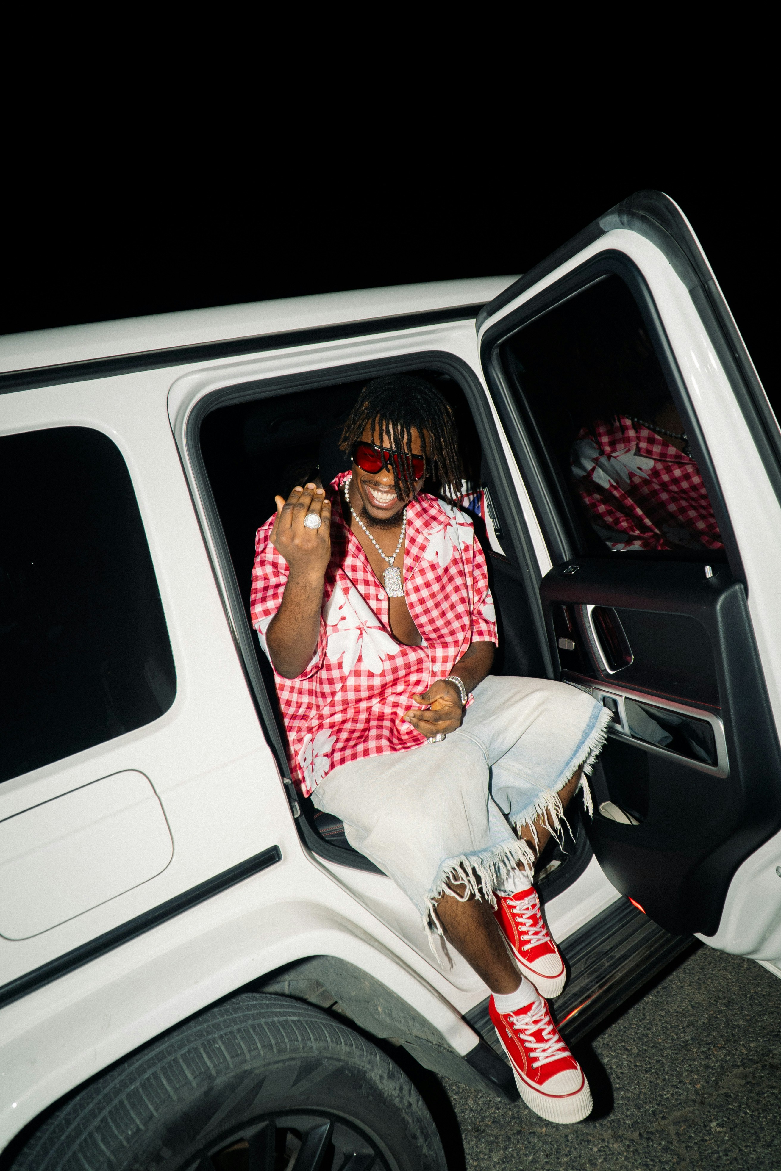 Red Plaid Swagger: Night Ride in a White SUV