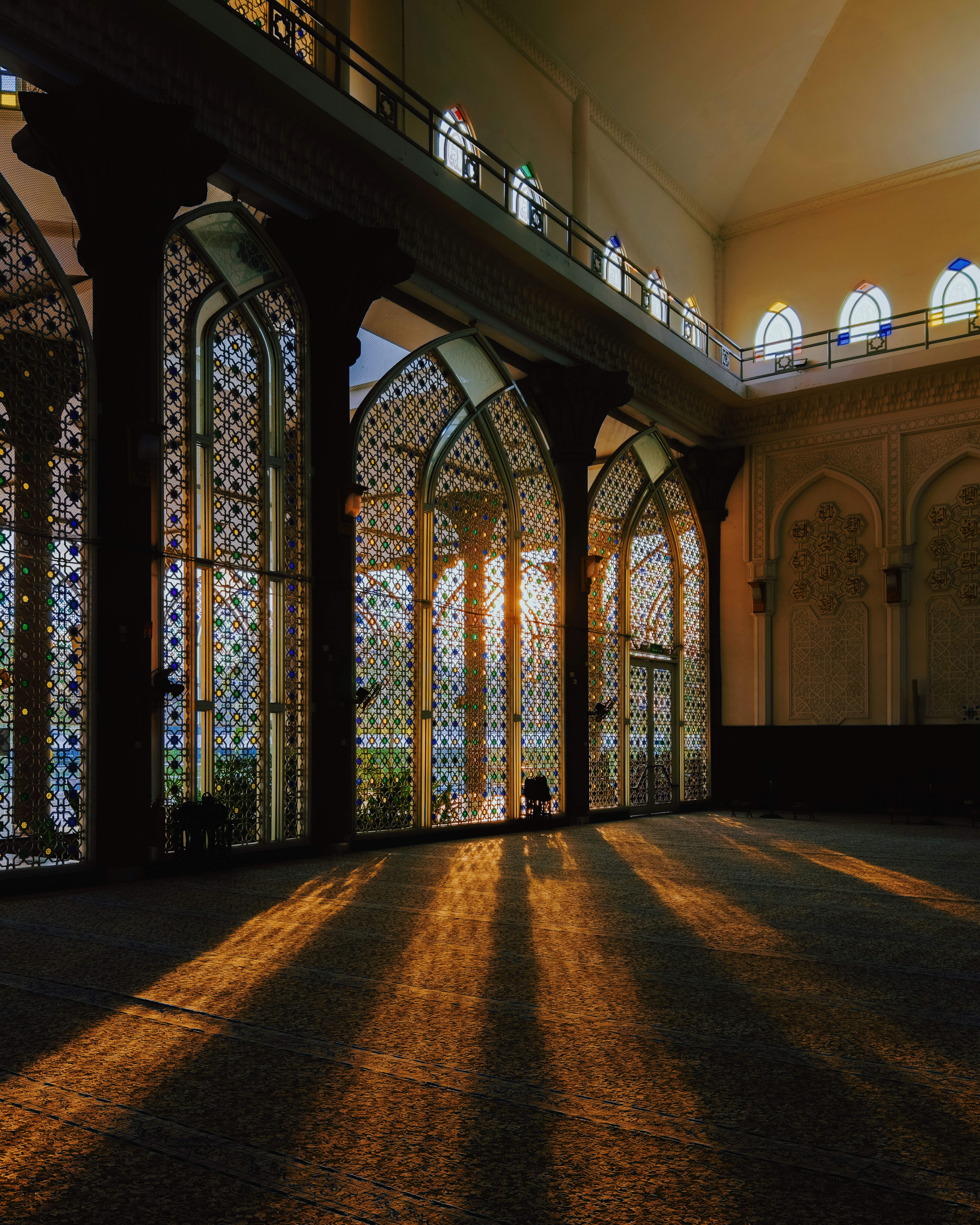 Masjid Sultan Abdul Samad. Shot on Oppo Find X8 Ultra. | Sunlight streams through arched windows, casting shadows on floor.