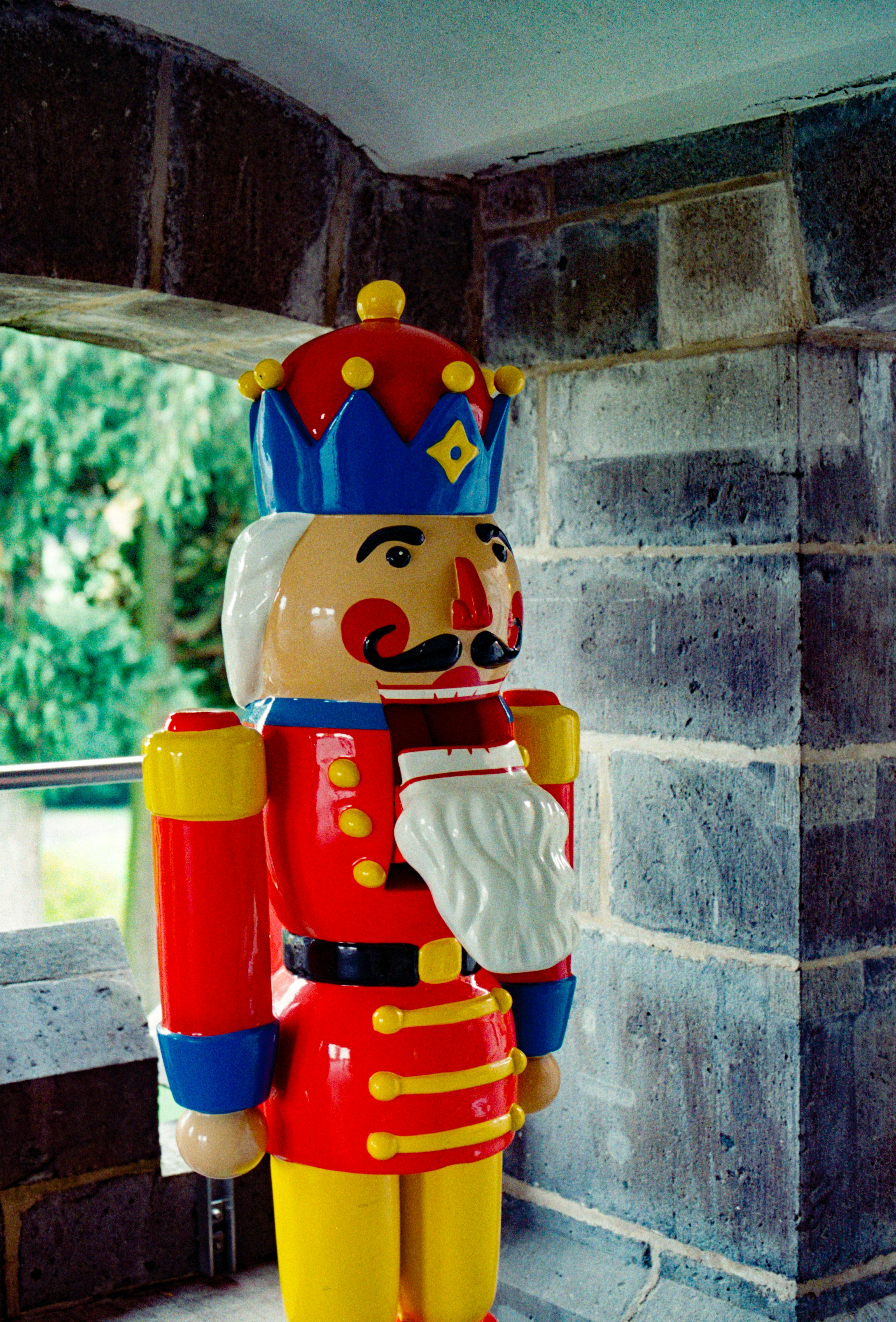 A colorful nutcracker soldier decoration stands guard.