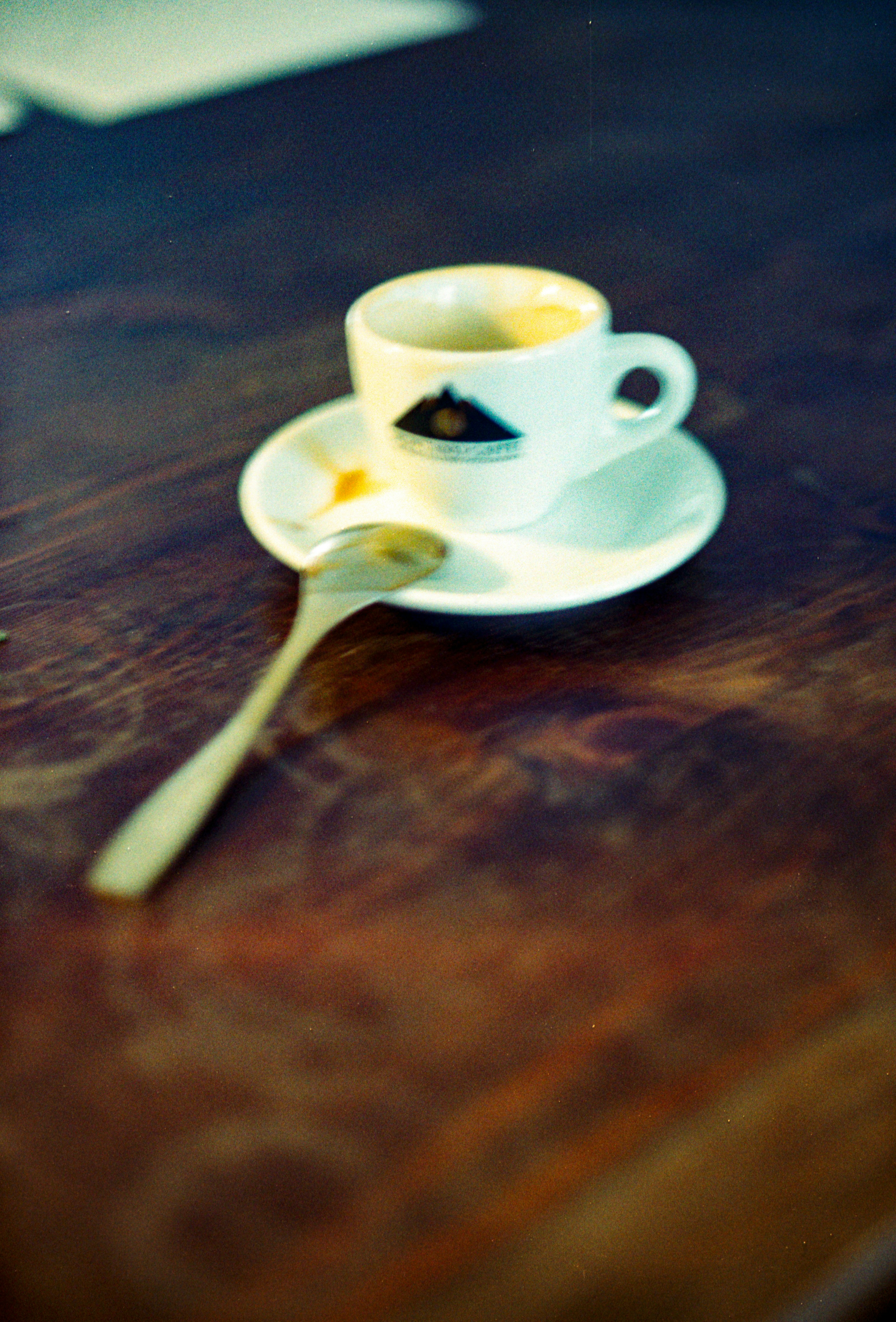 Espresso cup and saucer with spoon on table