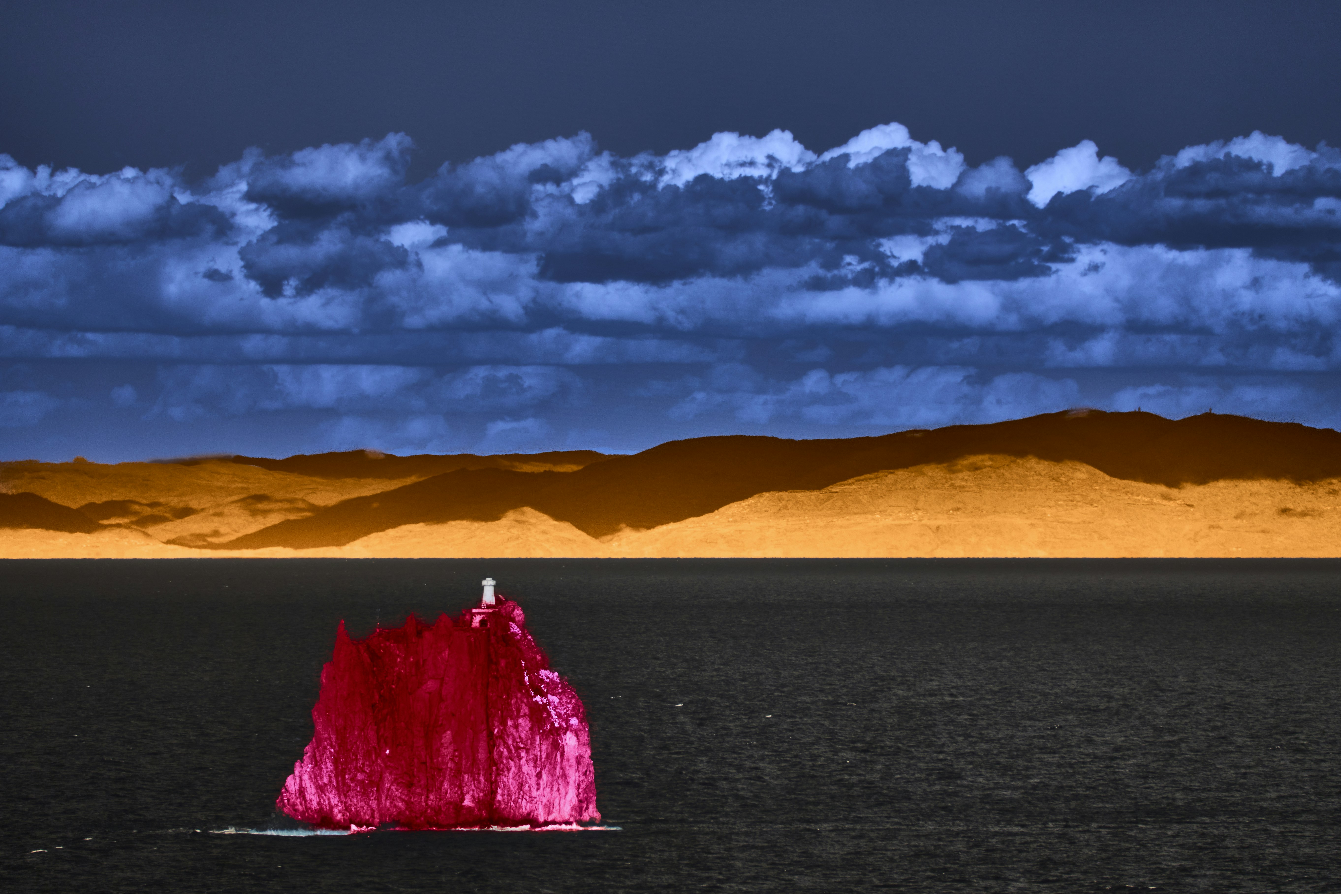 The Crimson Beacon Amidst the Azure Abyss