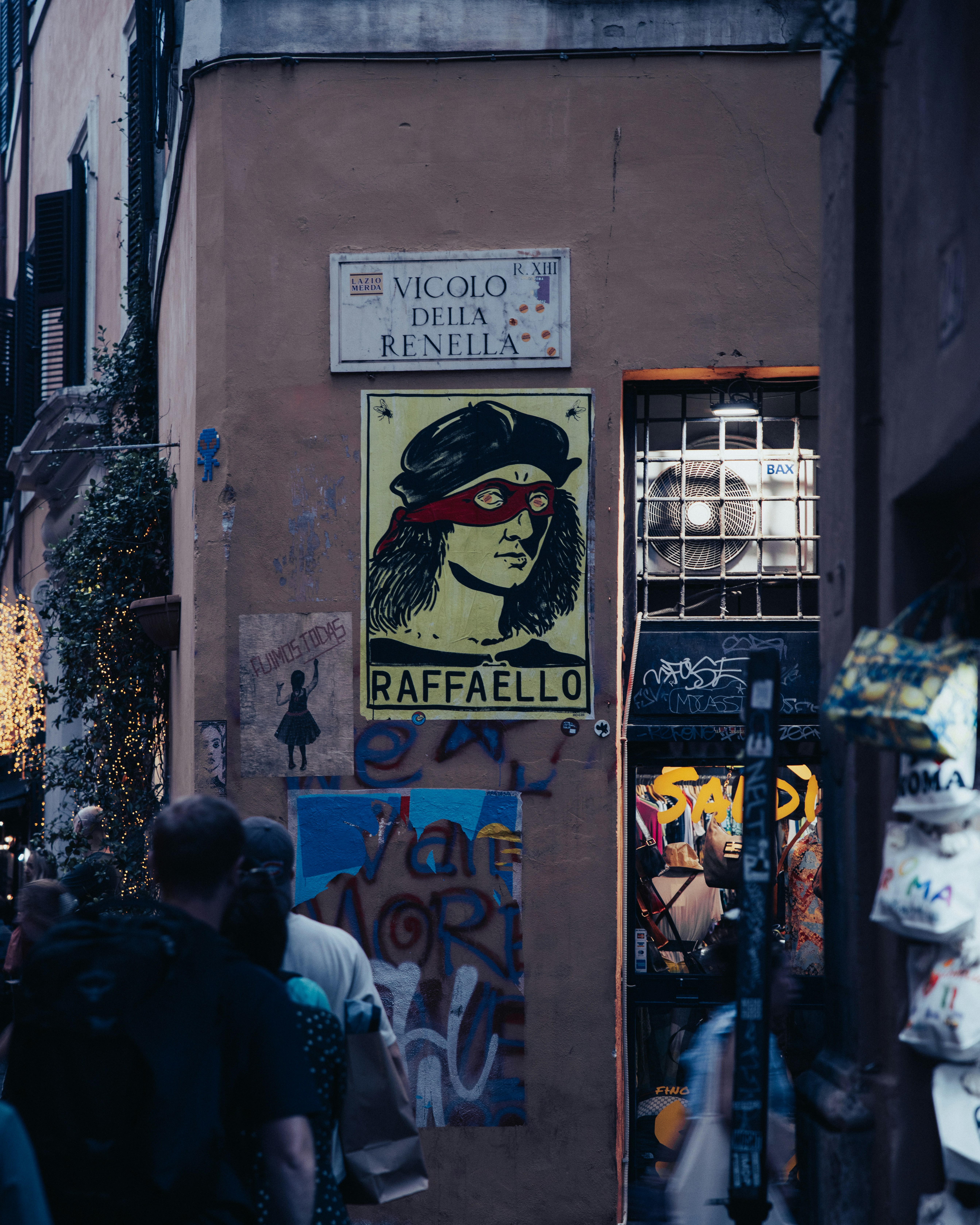 Street art featuring raffaello portrait on building