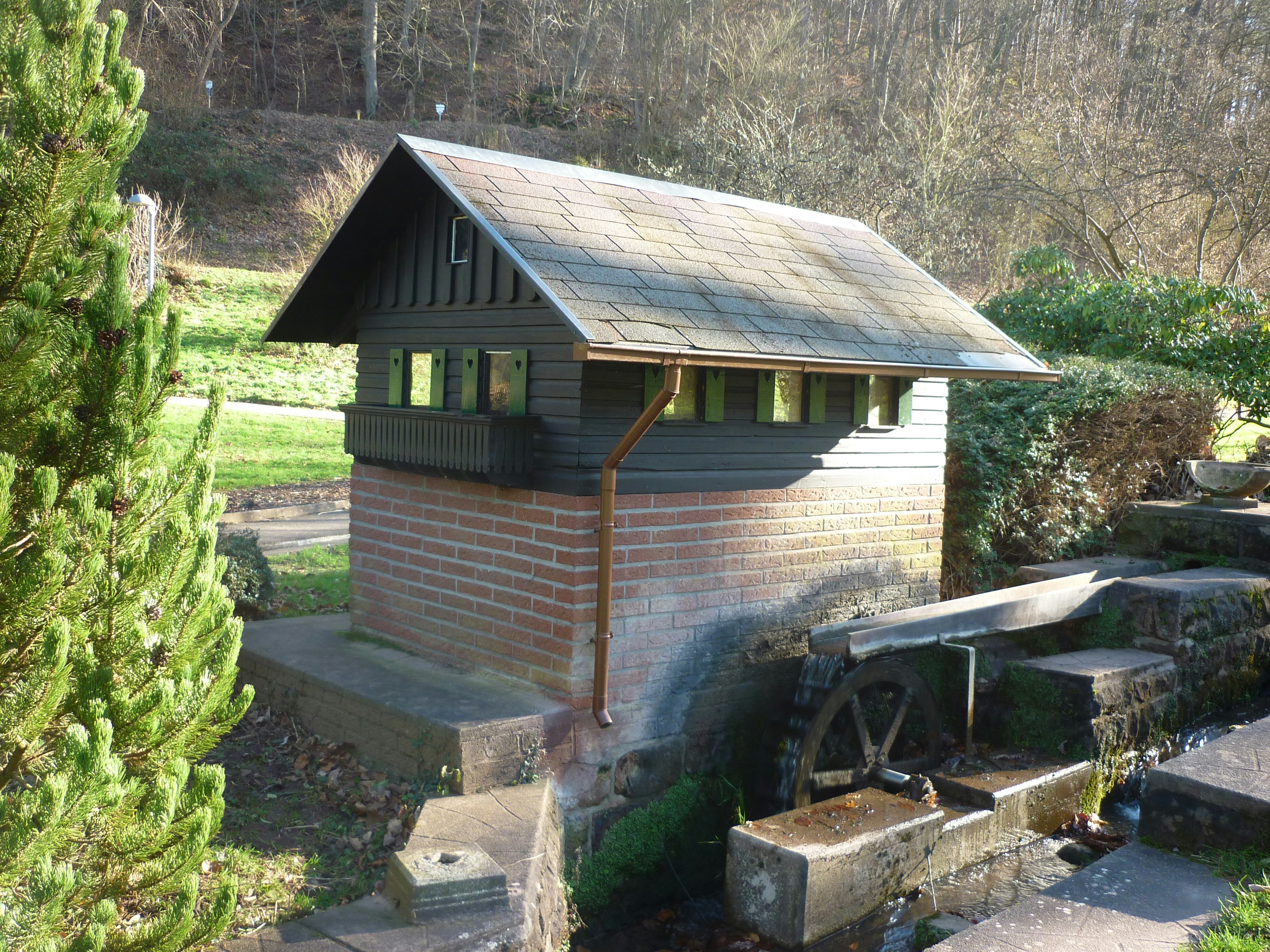 Kurpark Annweiler am Trifels Sony Alpa 6400 | Small water mill building with wooden wheel