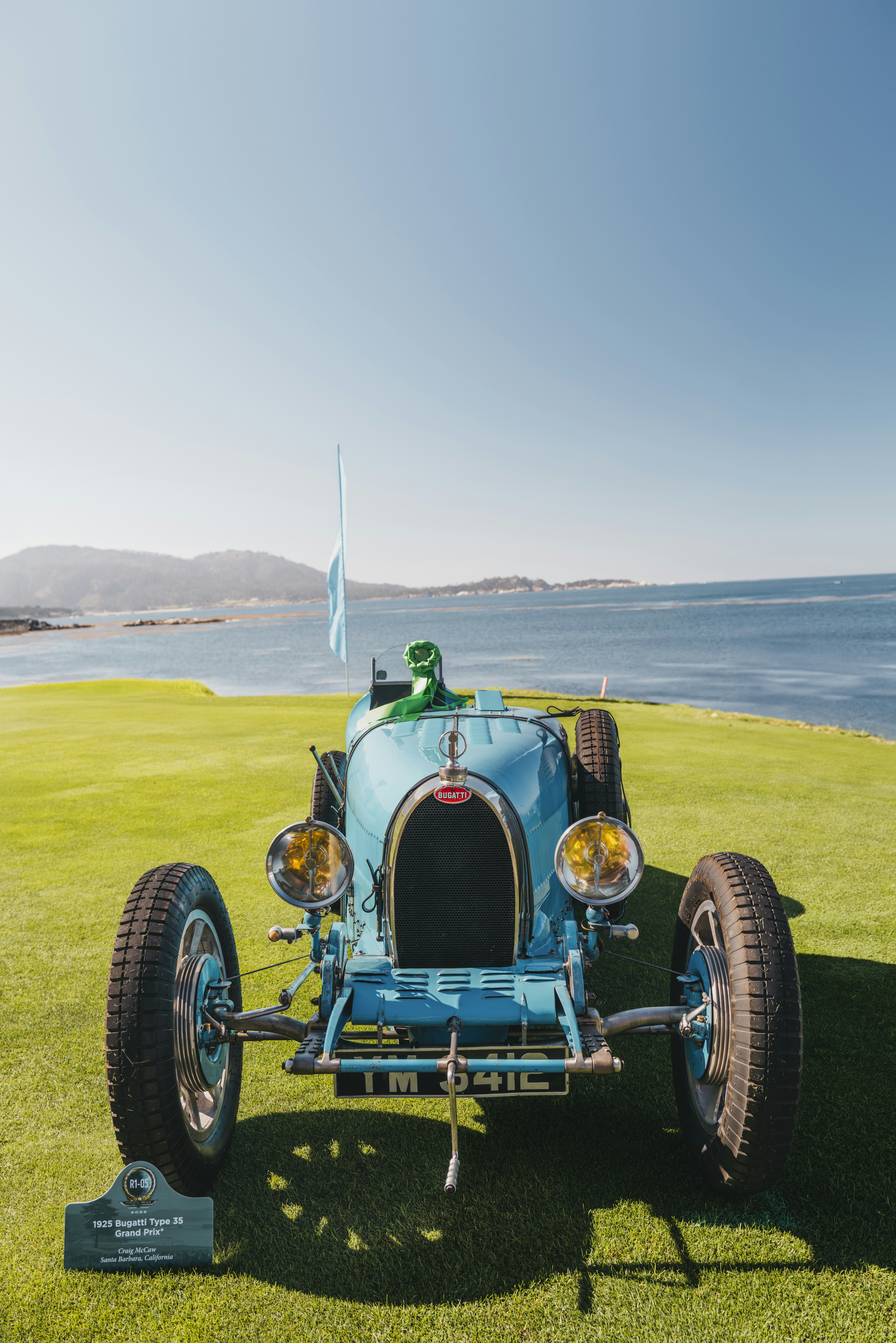 Bugatti Type 35 Grand Prix at Pebble Beach Concours | Vintage blue bugatti car on a grassy coast