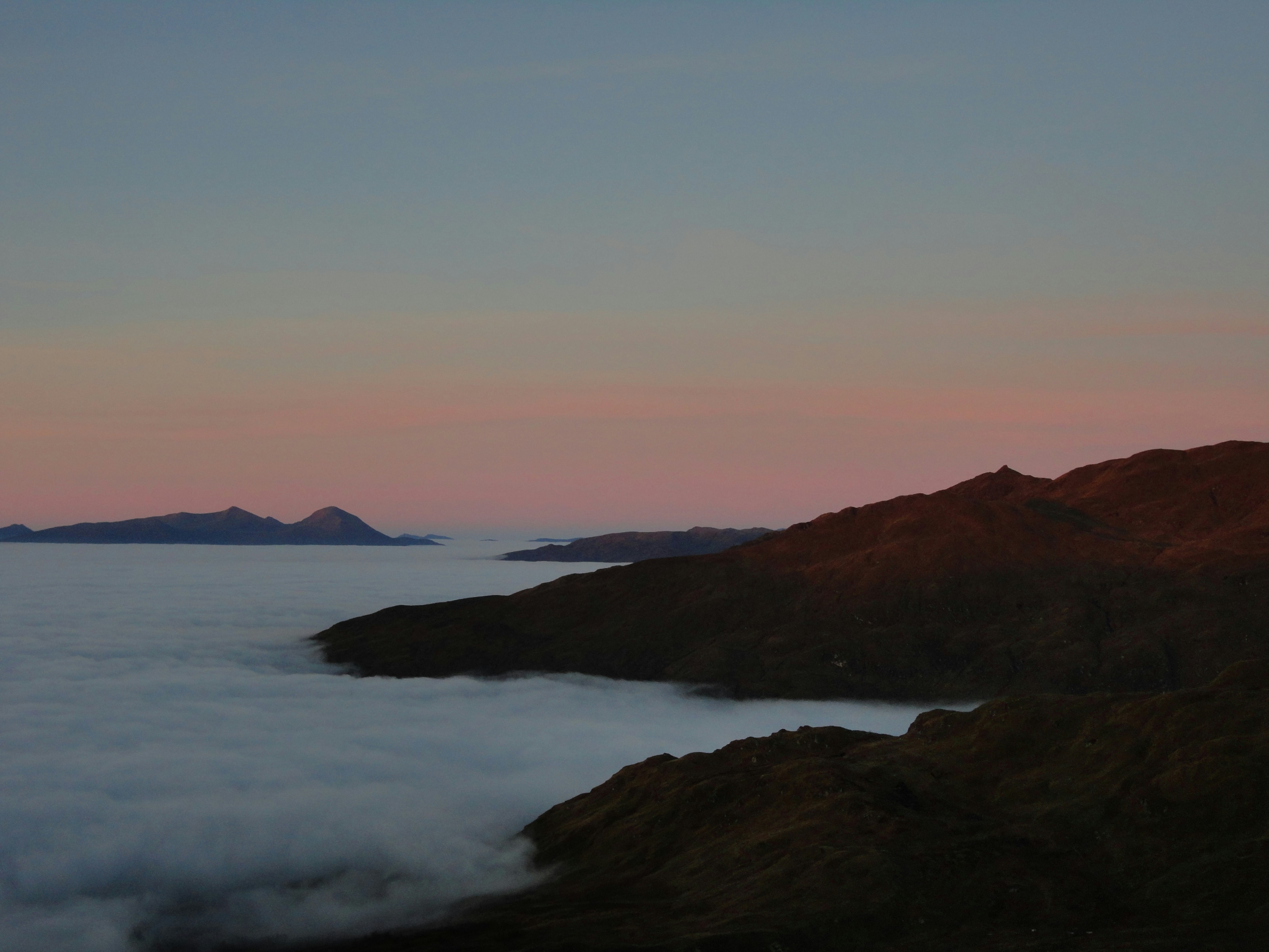 Ocean coast with fog at sunrise
