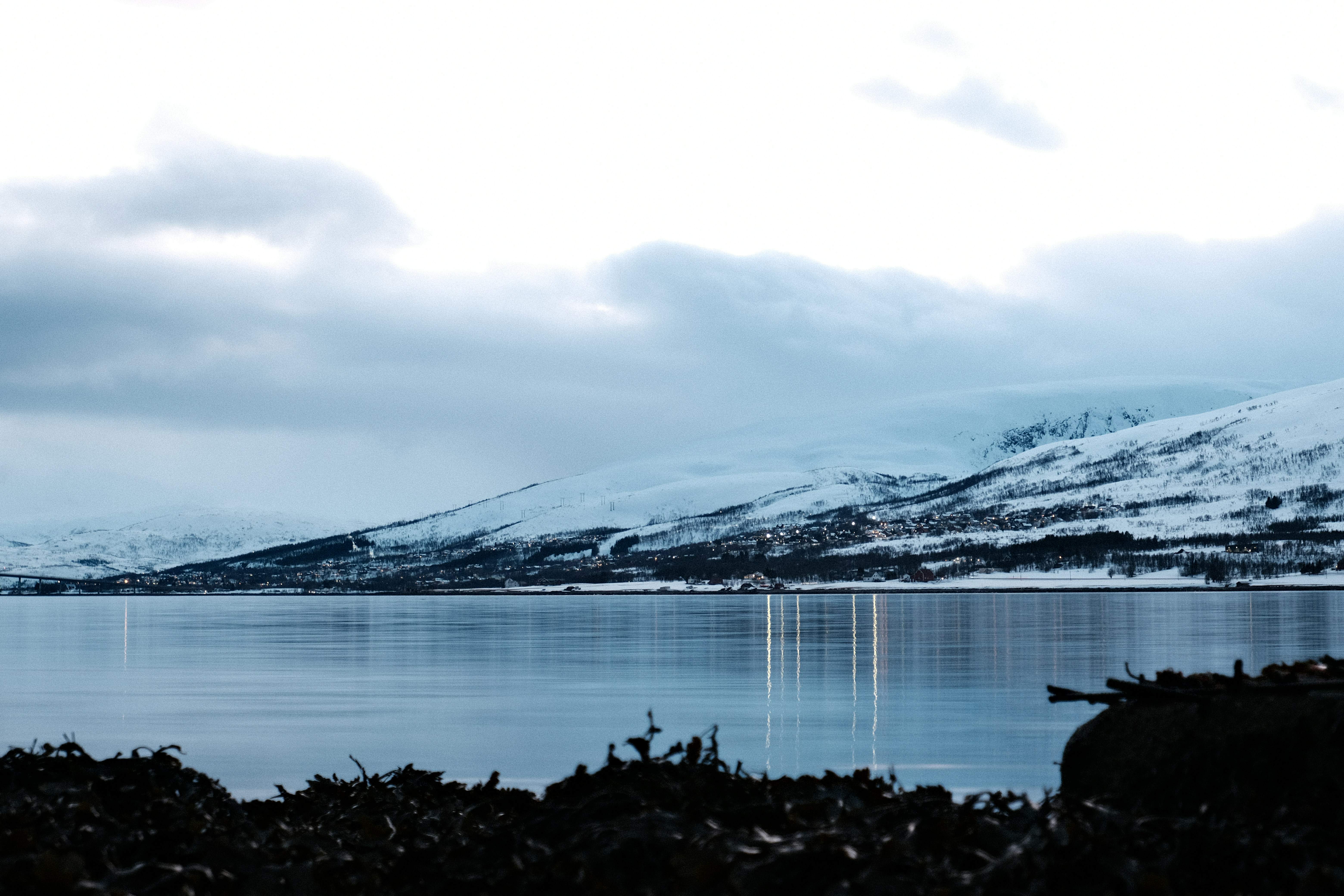 Snowy mountains reflected in a calm lake