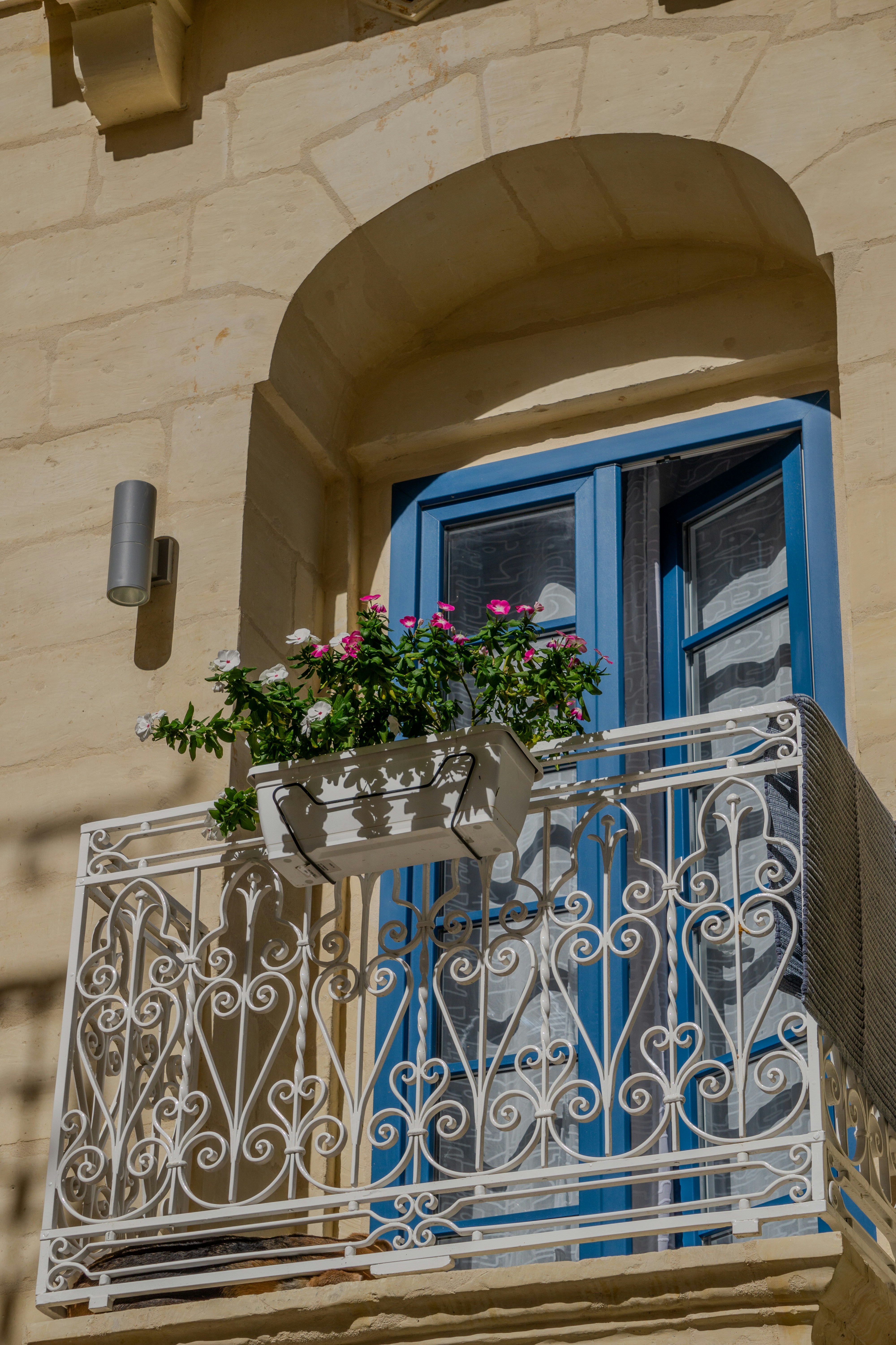 Balcony in Malta | Balcony with blue door and flower box
