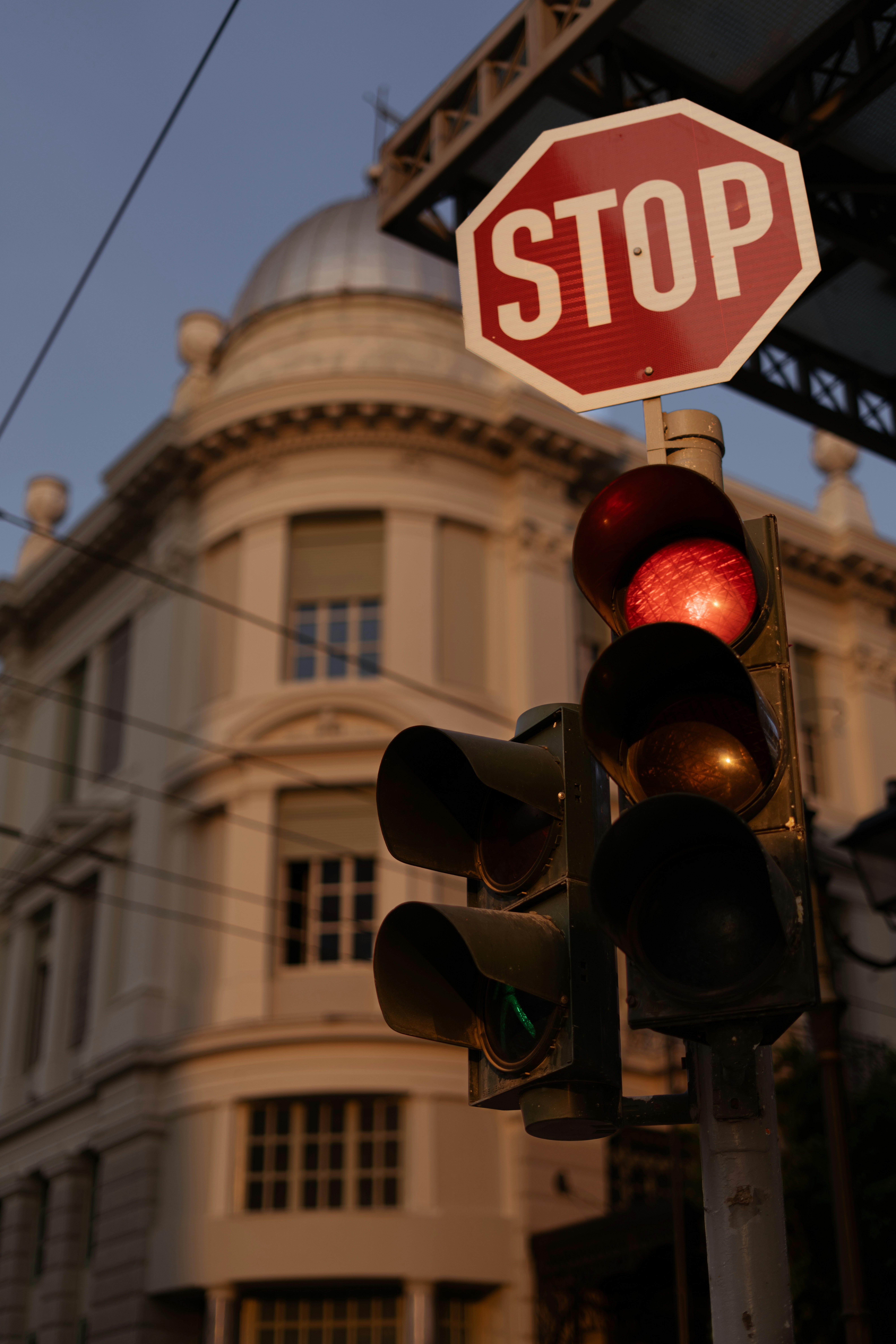 Stop sign and traffic light with building background building background
