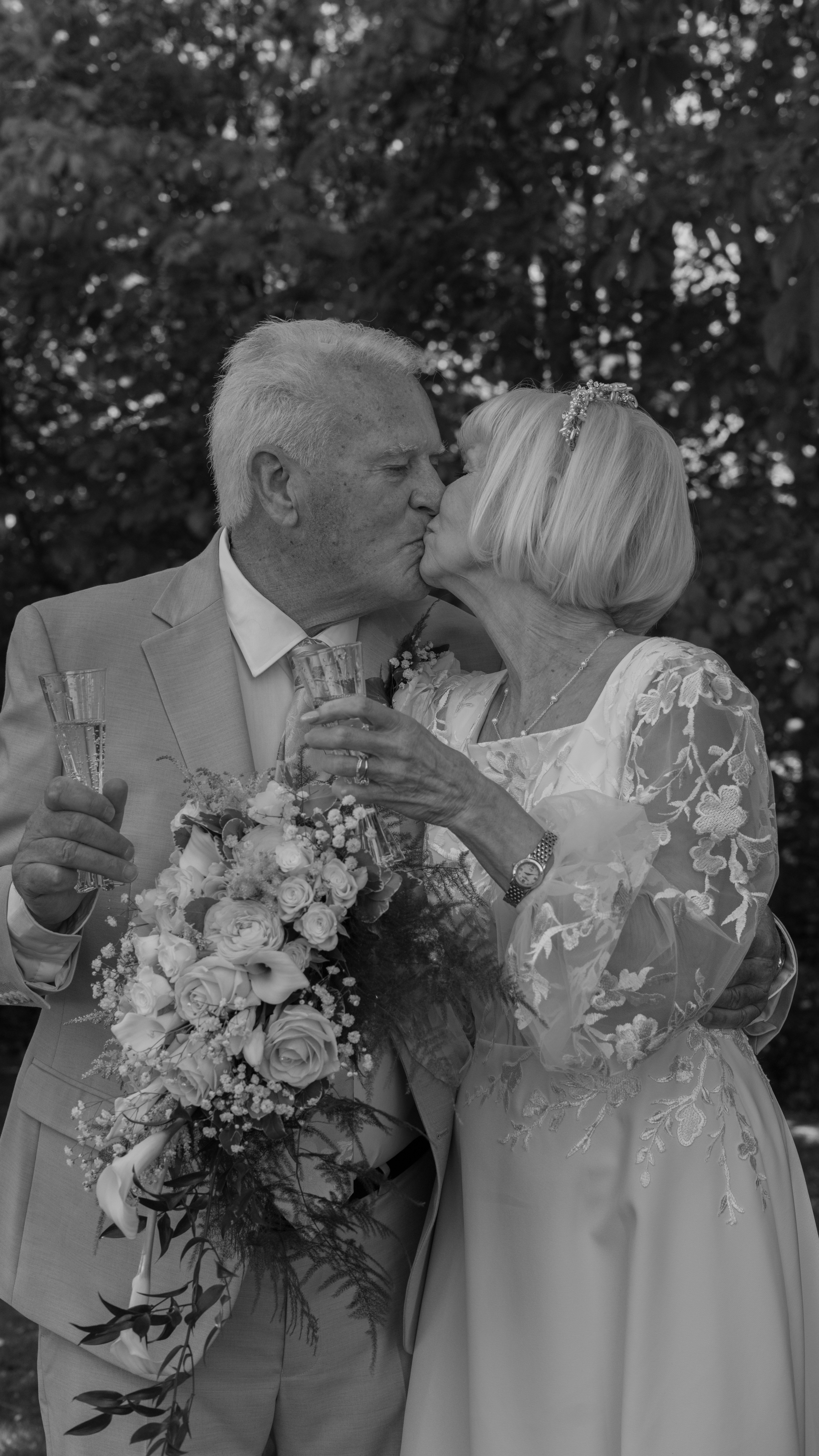 Monochrome Promise: A Gentle Wedding Kiss Between Lifelong Partners