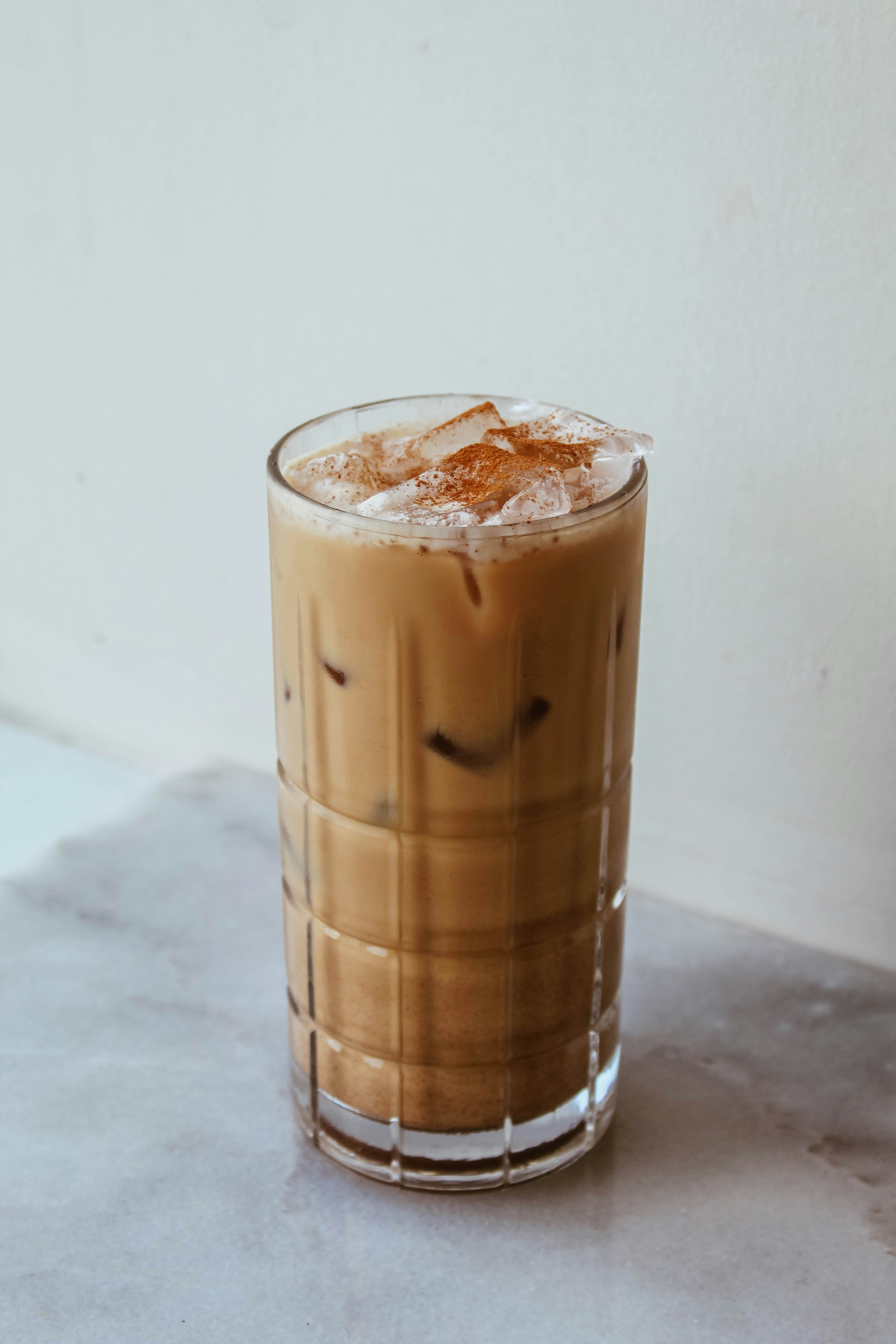 Iced coffee with cinnamon and ice cubes