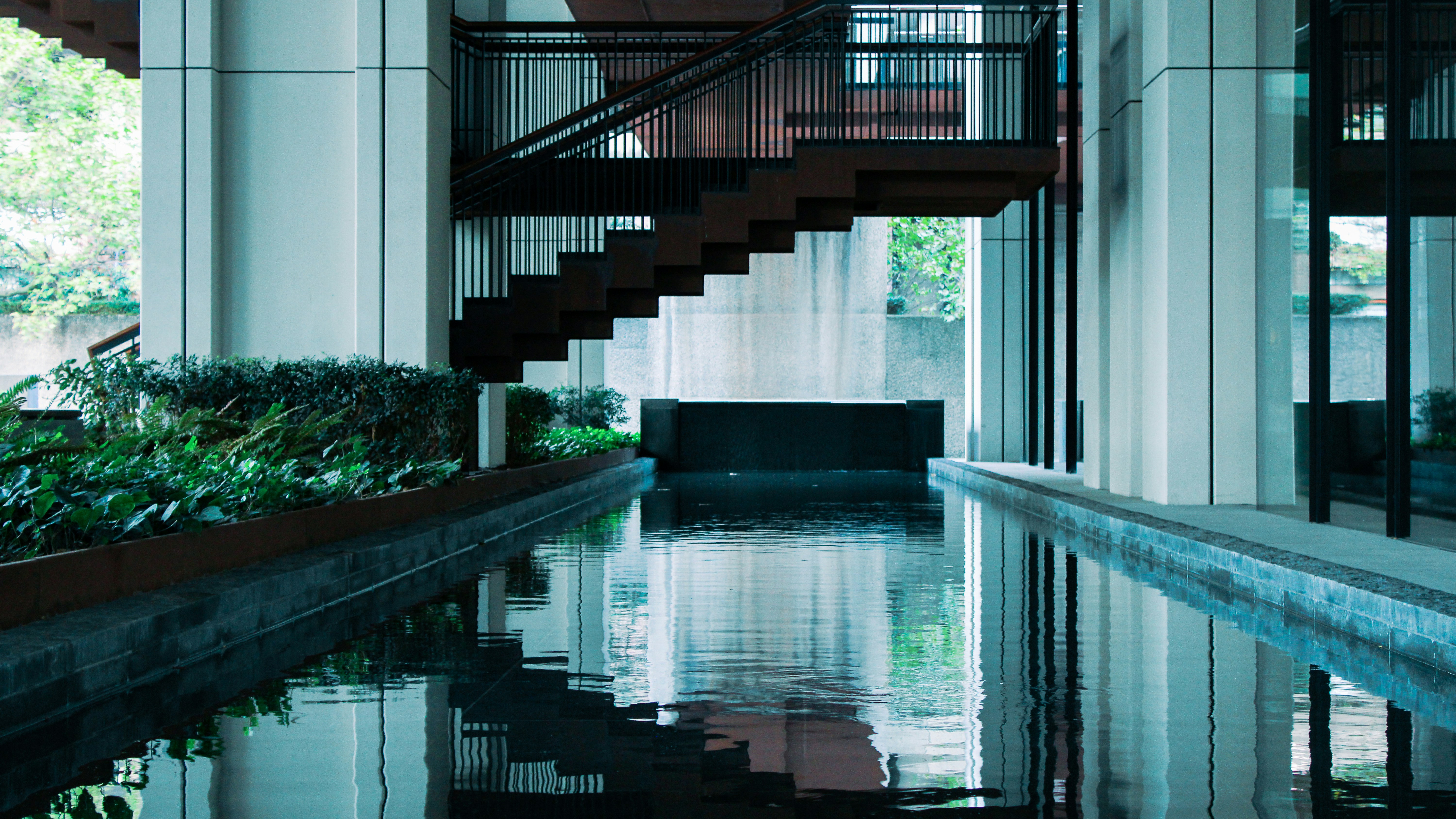 Modern building interior with water feature and stairs
