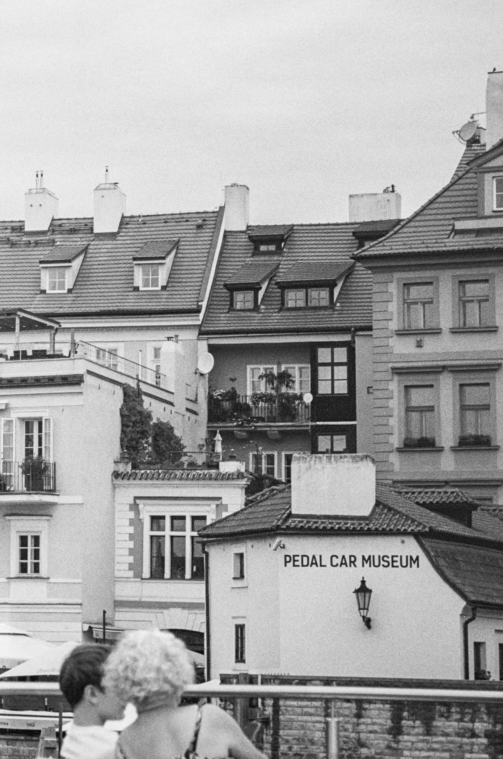 Pedal Car Museum Overlook: Rooftops and People in Focus
