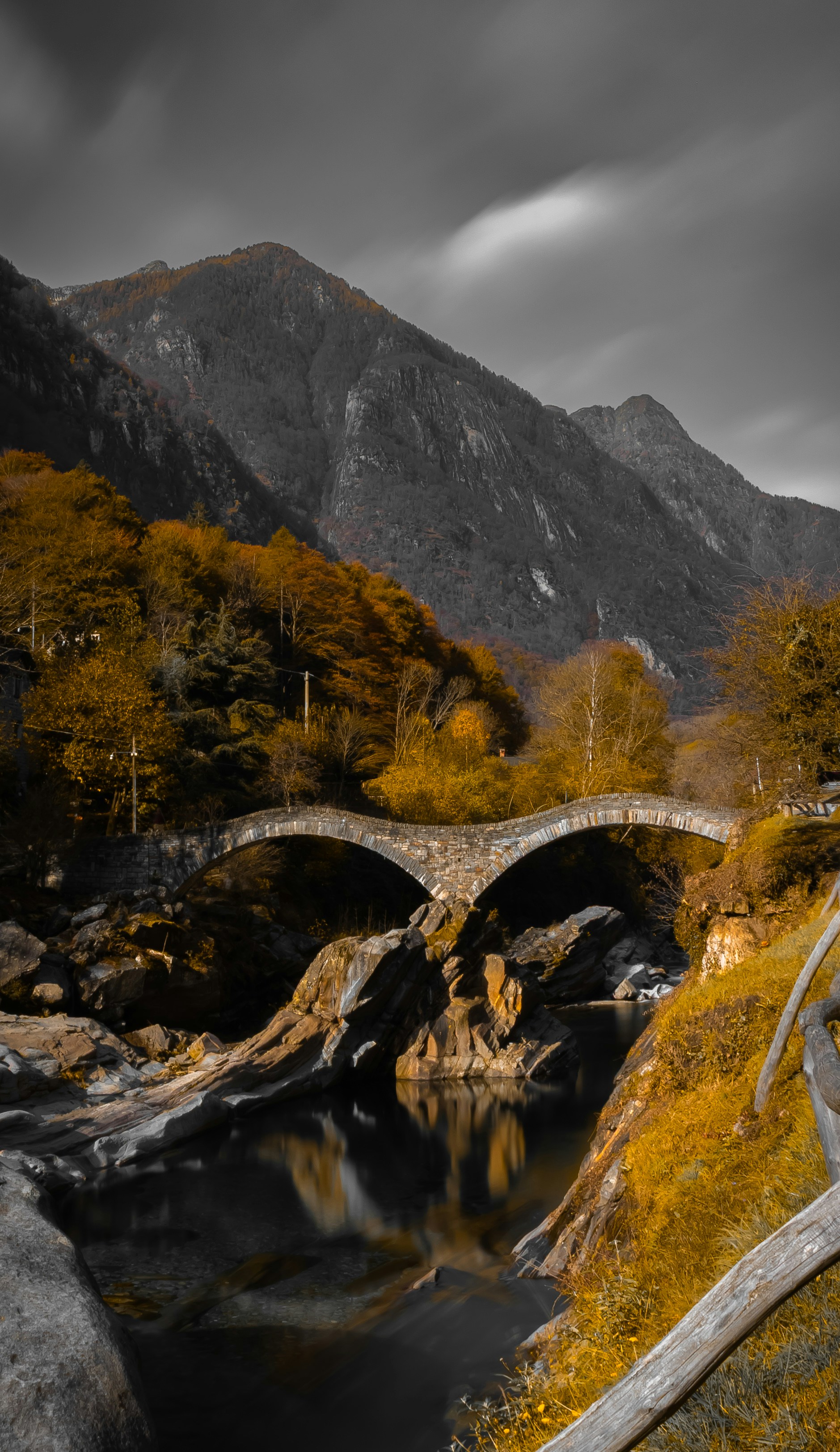 Autumn Arches Over Velvet Alpine River